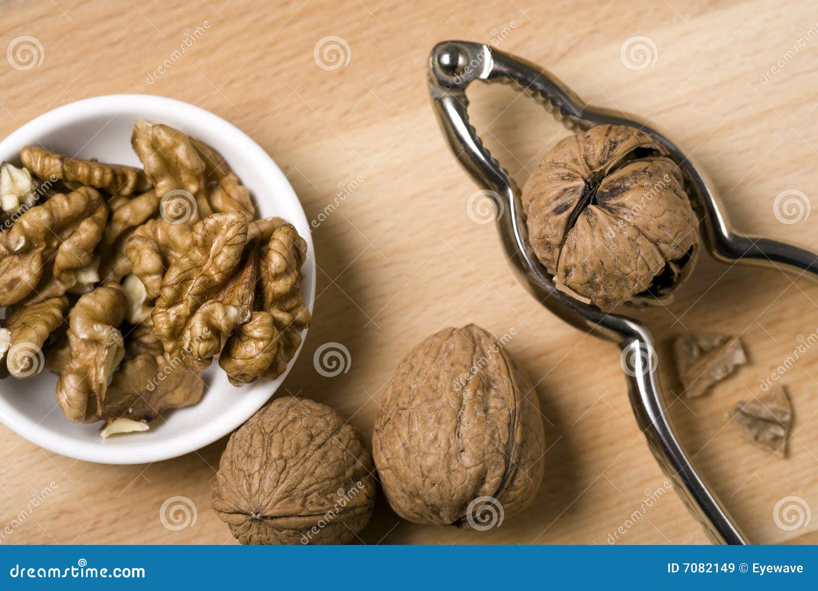 Cracking walnuts stock image. Image of utensil, bowl, nuts - 7082149
