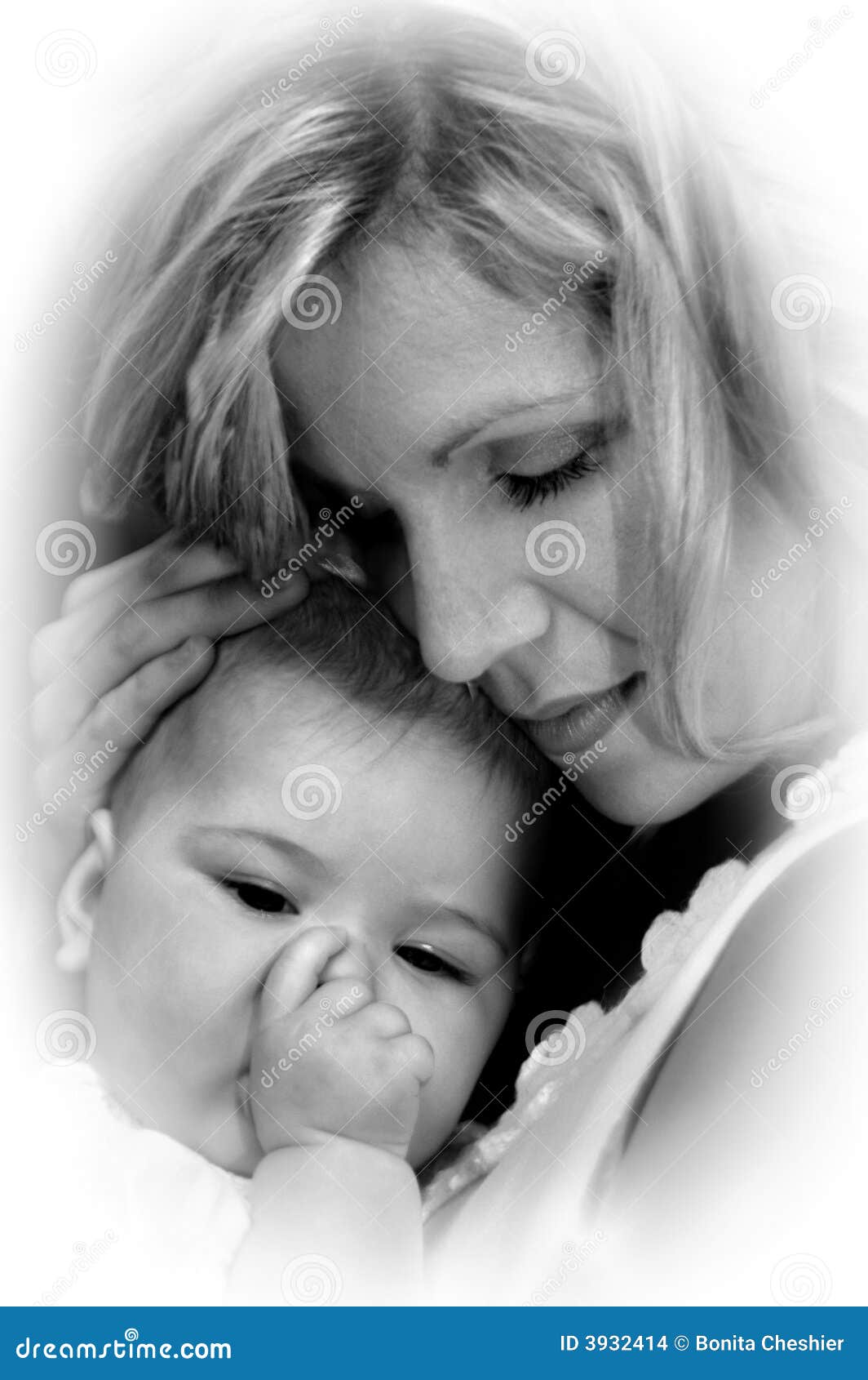 Craddlling her baby stock photo. Image of closed, leaning - 3932414