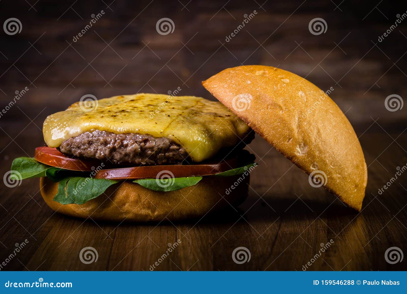 Craft Beef Burger with Cheese and Rocket Leafs on Wood Table and Rustic ...
