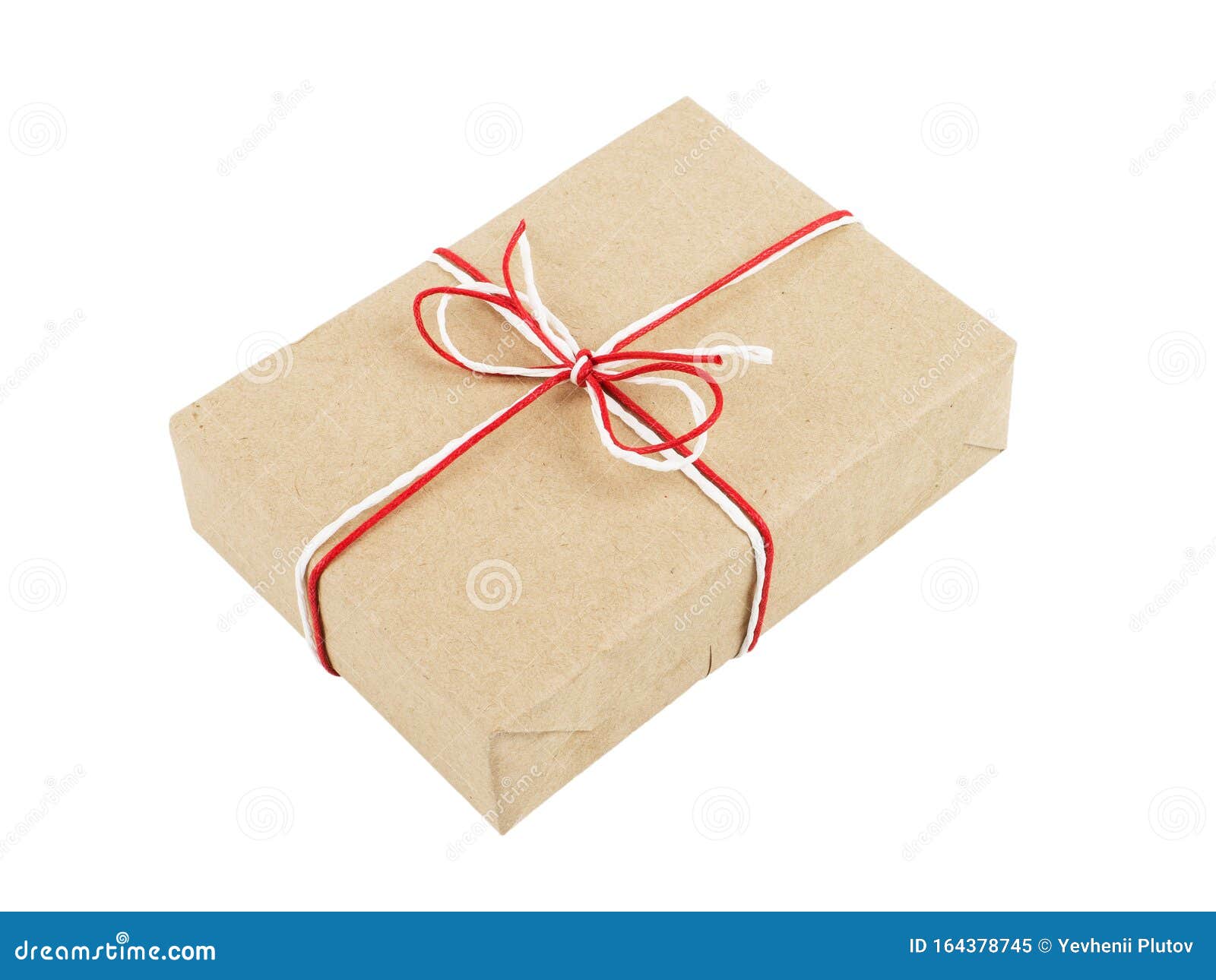 From Craft Paper, a Gift Tied with a Red and White Rope and a Bow ...