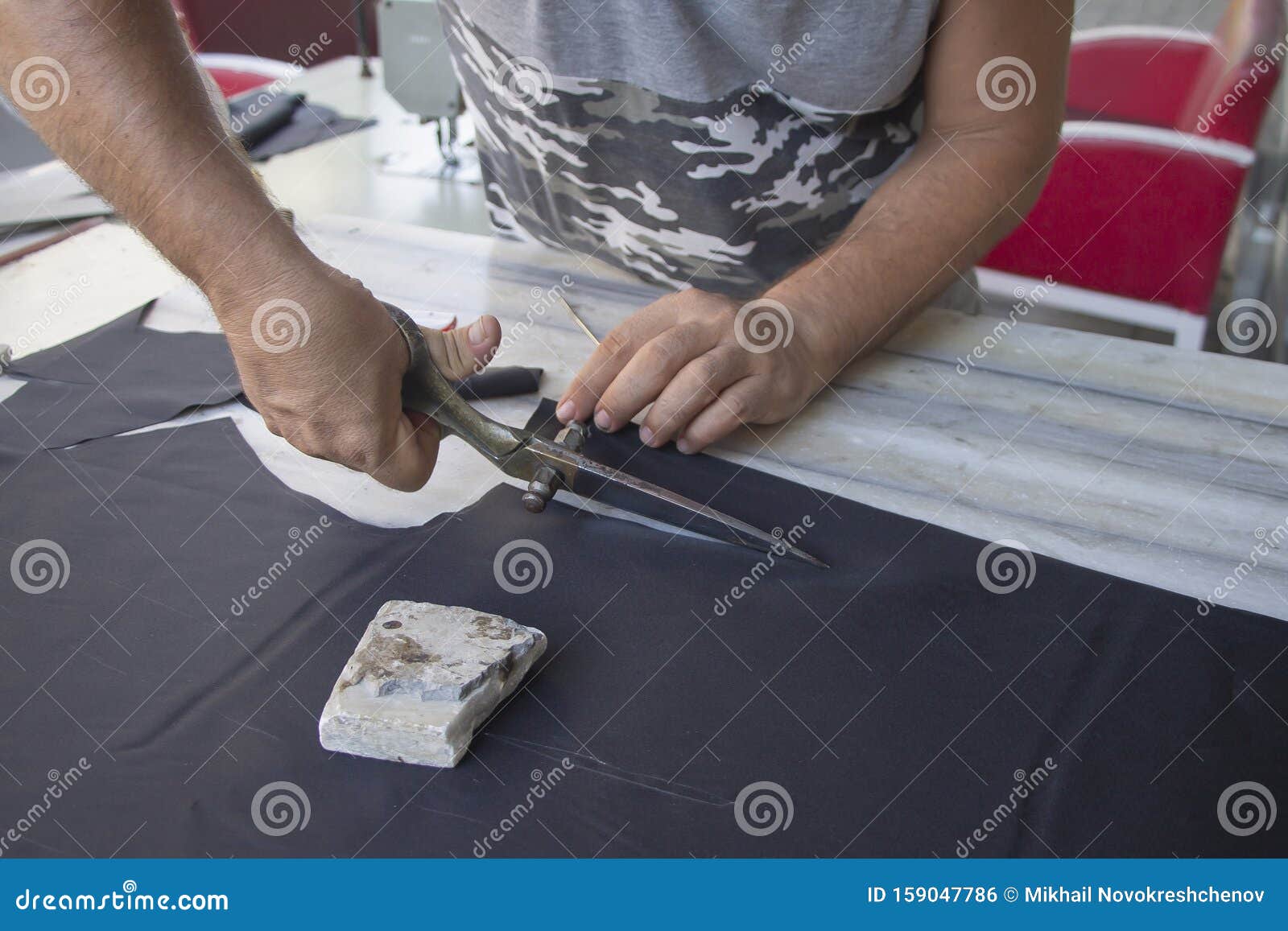 Craft Workshop on Sewing Leather Jackets. the Master Cuts the Skin ...