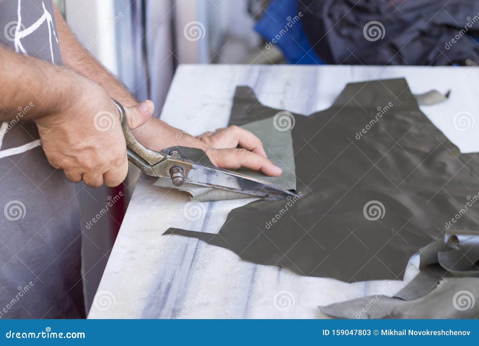 Craft Workshop on Sewing Leather Jackets. the Master Cuts the Skin ...