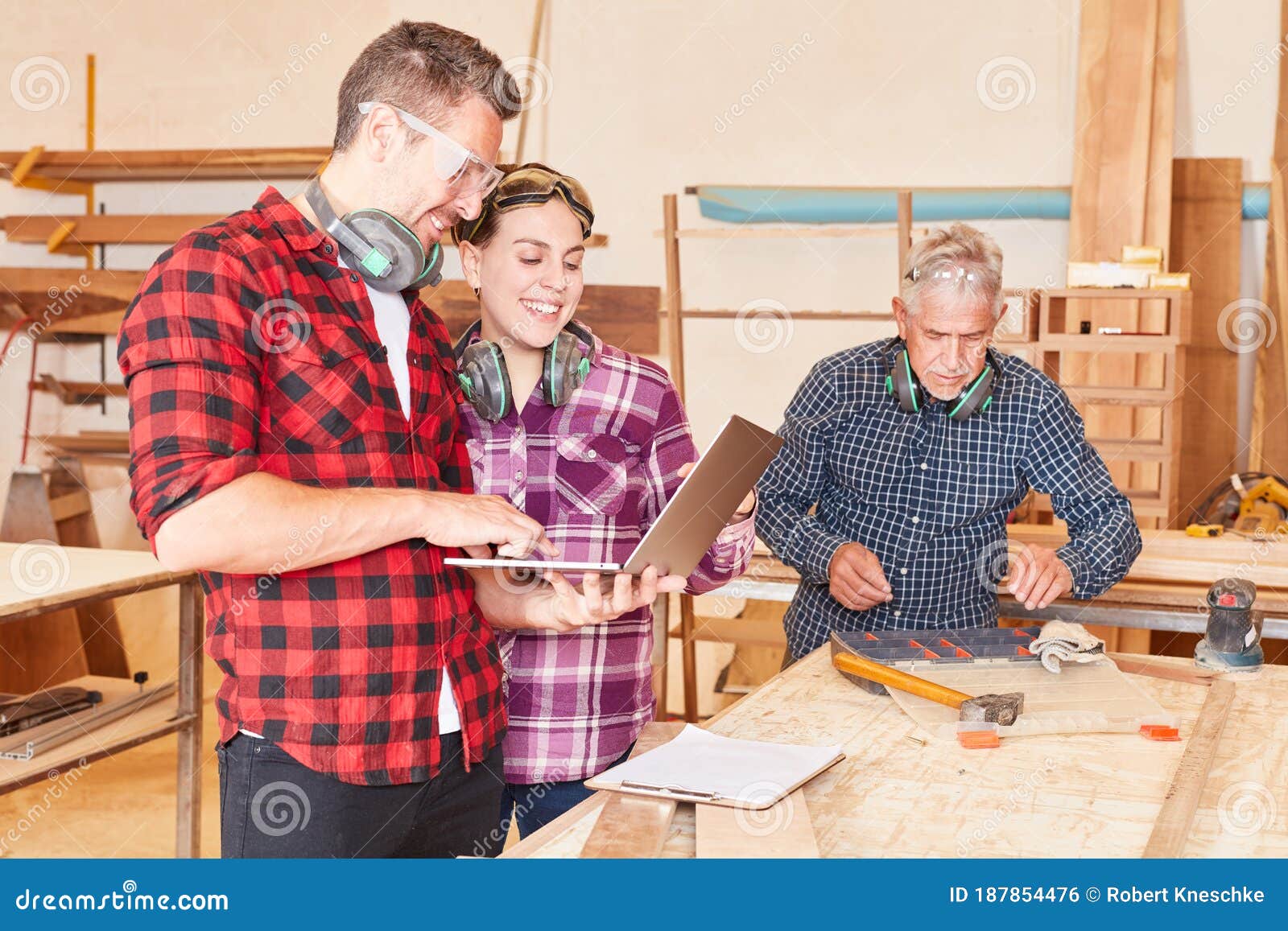 Craftsman and Apprentice Together at the Laptop Stock Photo - Image of ...