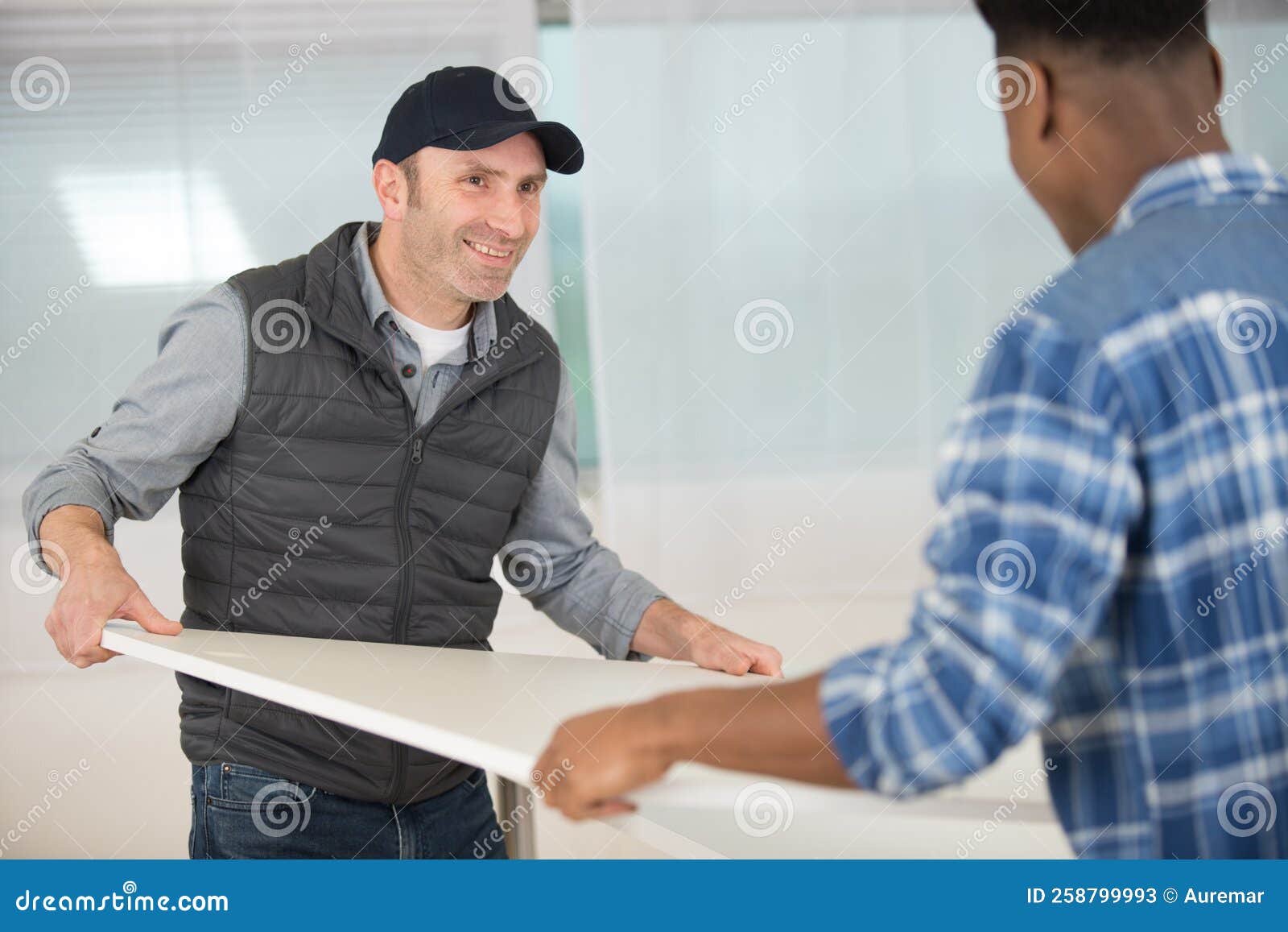 Craftsman and Apprentice Work Together in Workshop Stock Image - Image ...