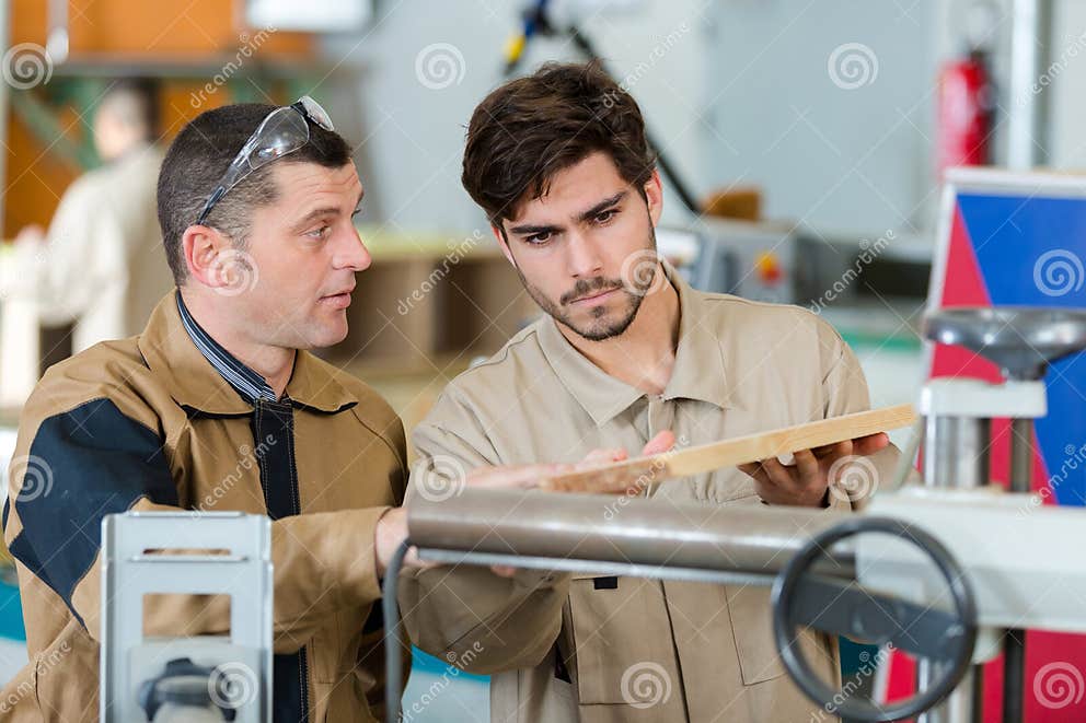 Craftsman and Apprentice in Workshop Stock Photo - Image of worker ...