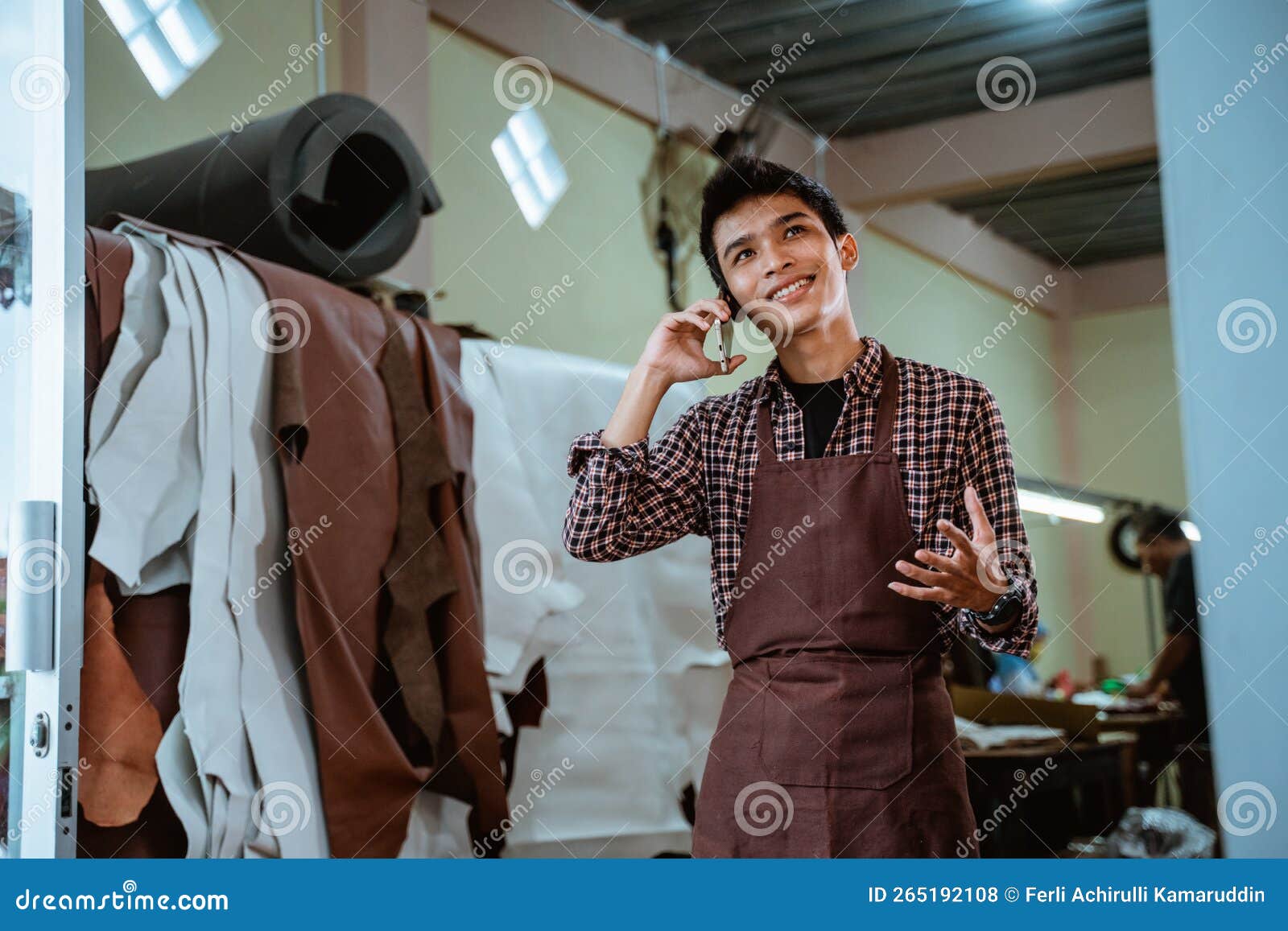 Craftsman in Apron Making Phone Calls at Leather Workshop Stock Photo ...