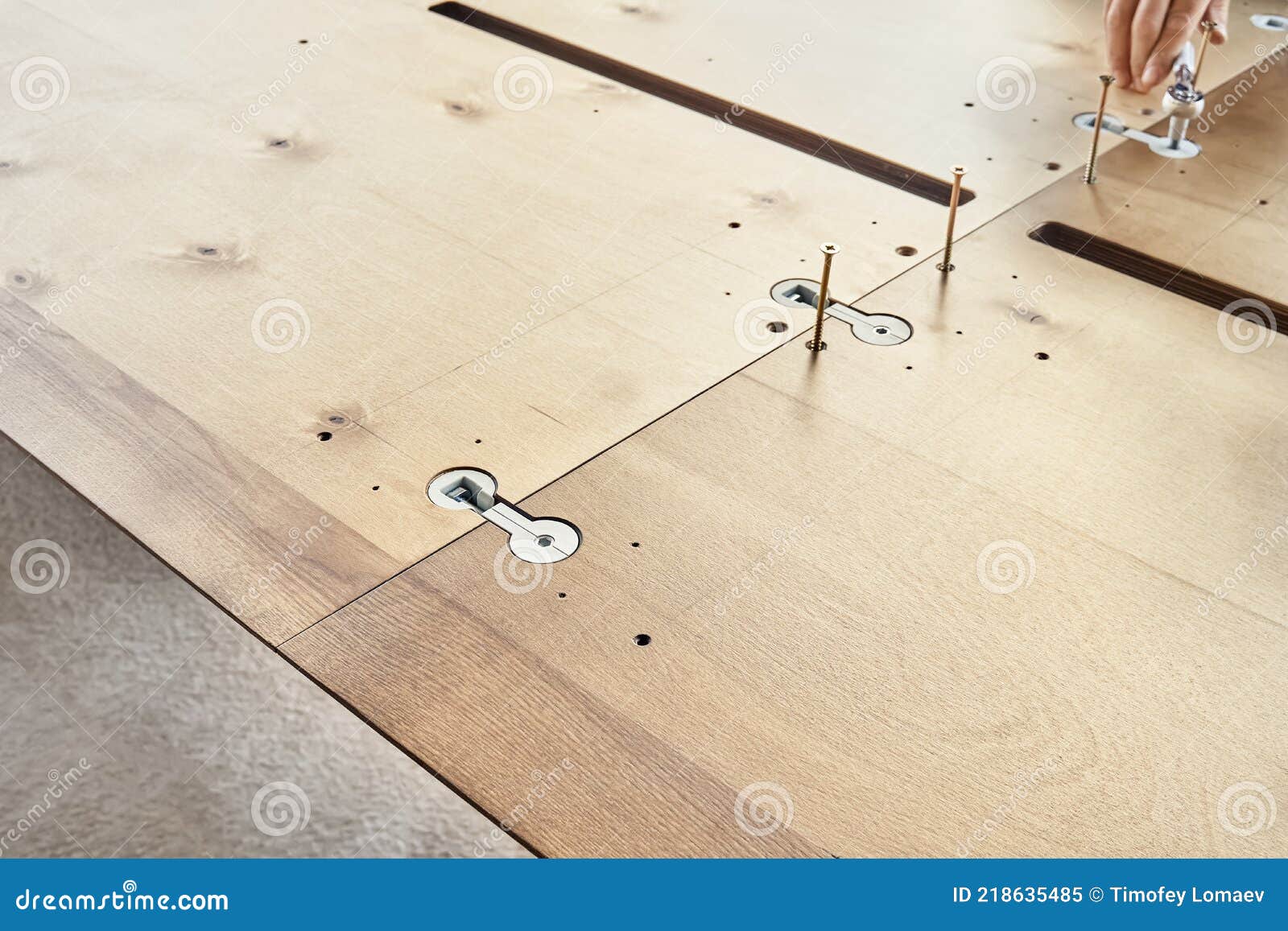 Craftsman Assembles Dining Table Turning Worktop Connector with Wrench ...