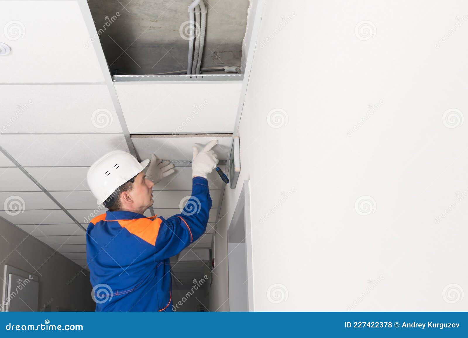 The Craftsman Assembles the Suspended Ceiling, Side View Stock Photo ...