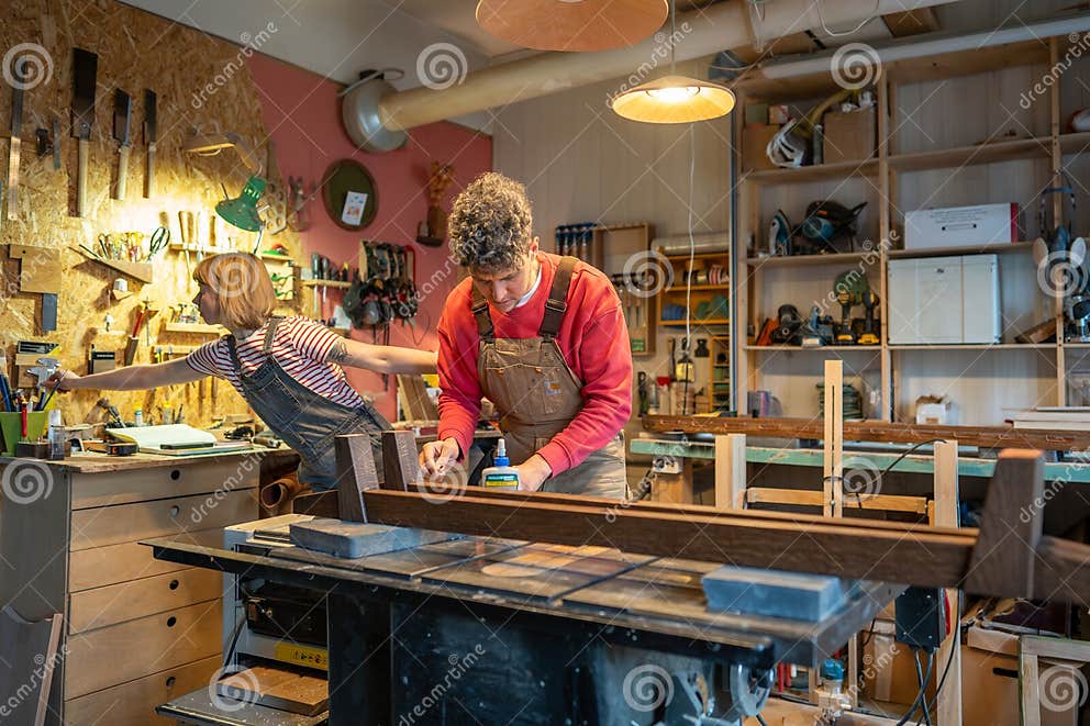 Artisan Collaborating with Apprentice Assistant, Constructs Bed Frame ...