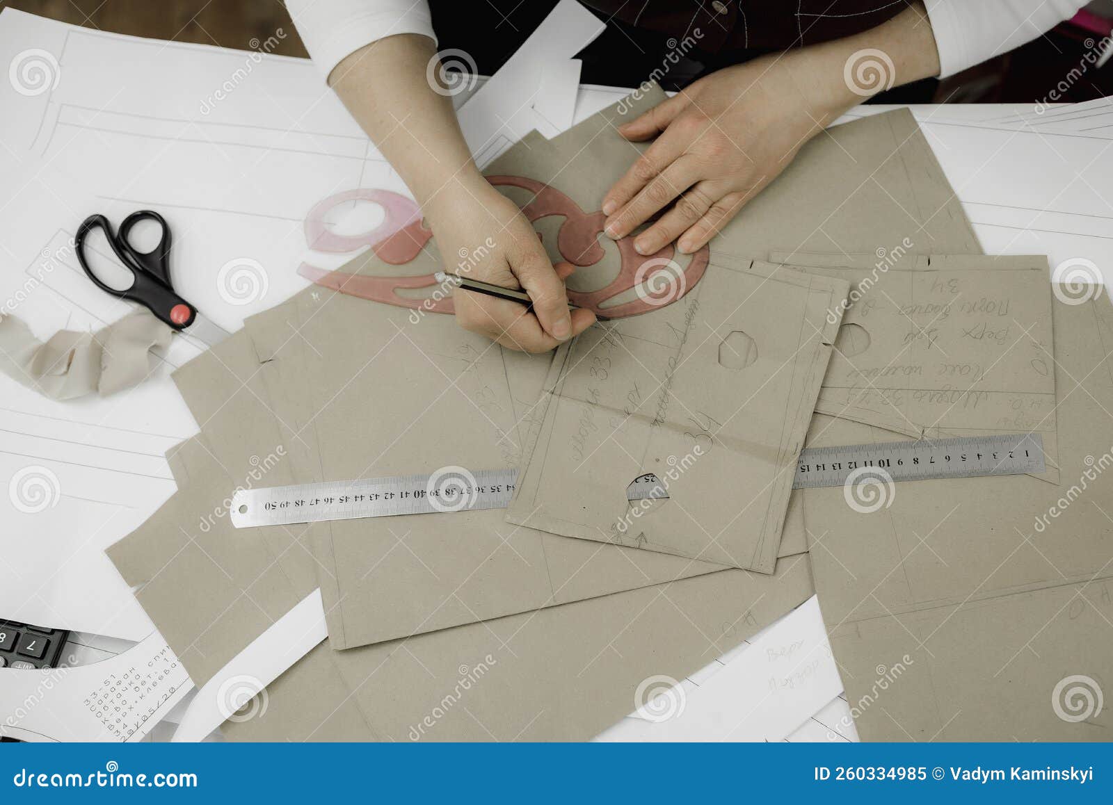 The Craftsman Draws Cutting Patterns for Sewing Clothes Stock Image ...