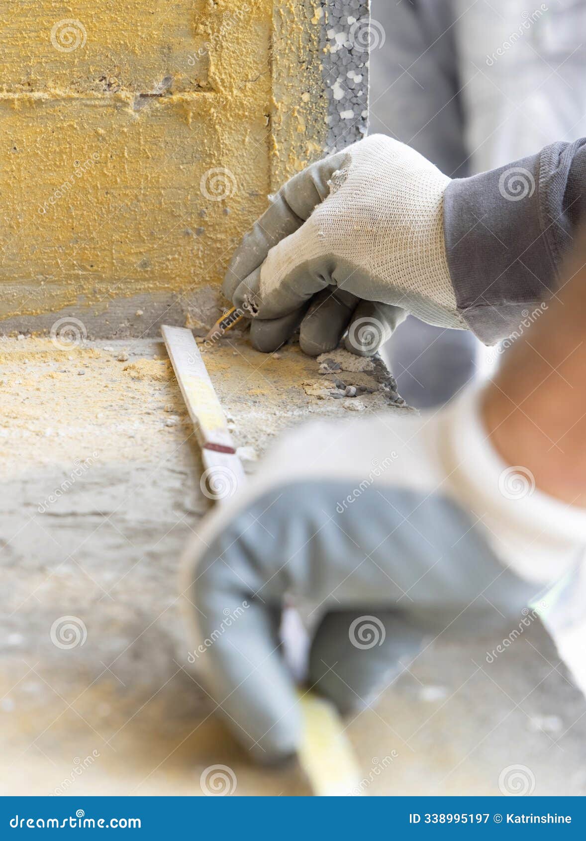 Craftsman in Gloves Measuring a Dirty Surface with Folding Ruler ...