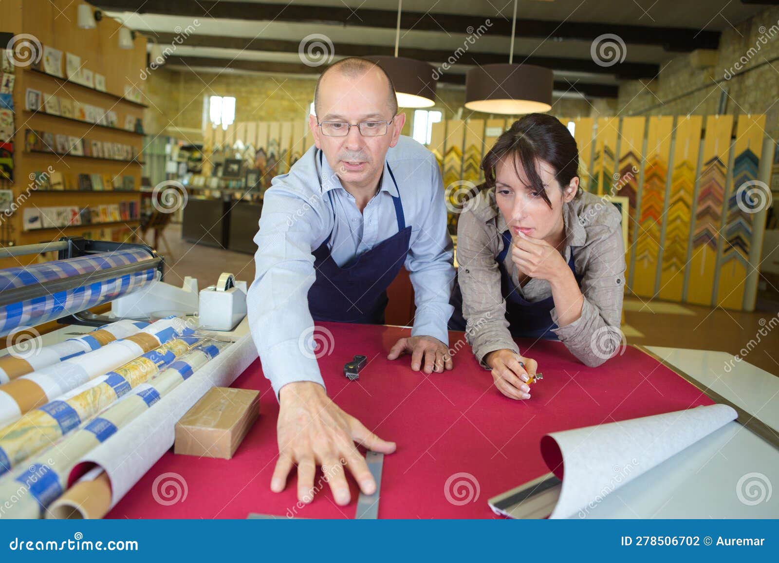 Craftsman and Helper Working on Frame in Frame Shop Stock Photo - Image ...