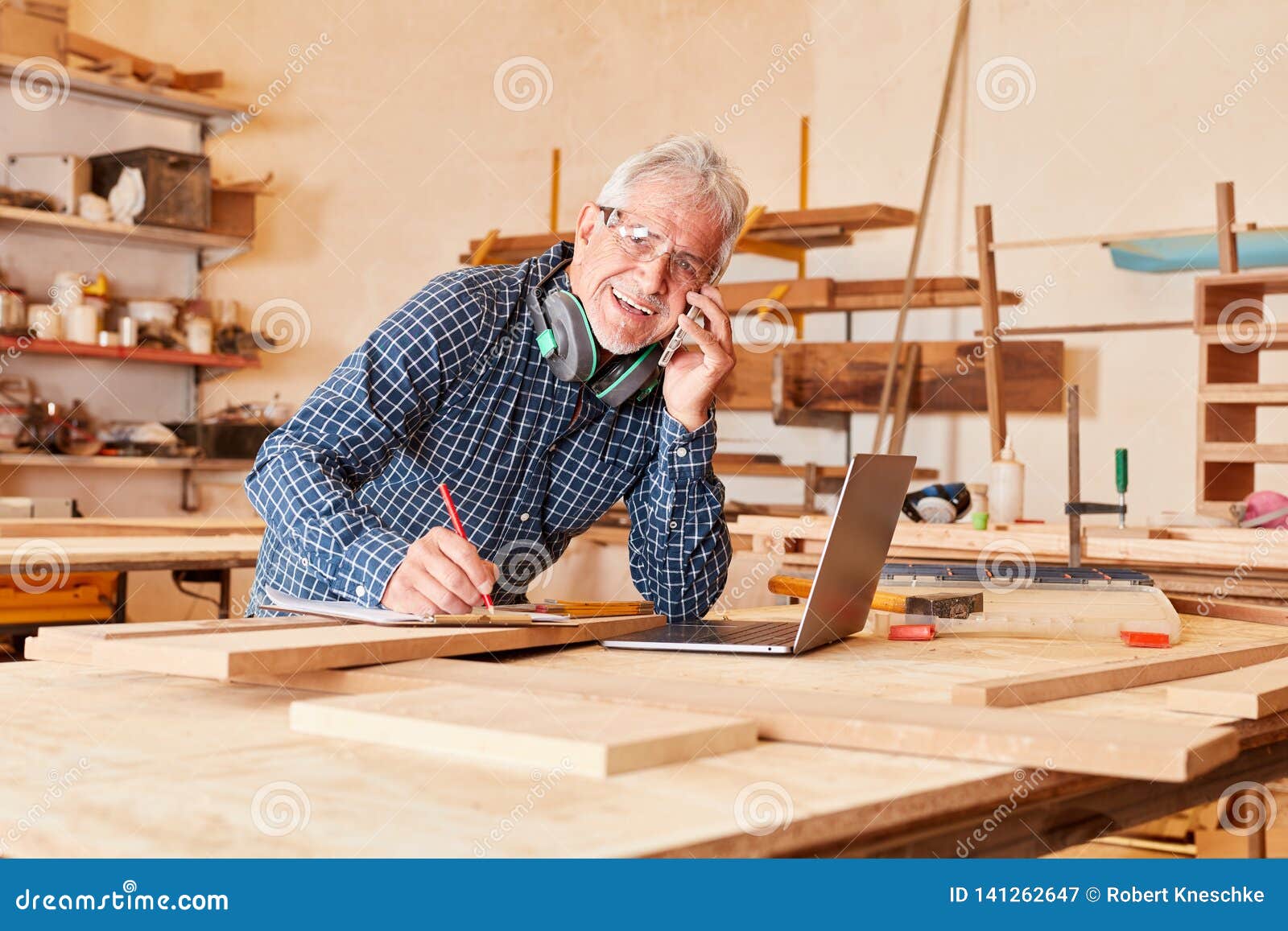 Craftsman with Laptop Computer and Mobile Phone Stock Image - Image of ...
