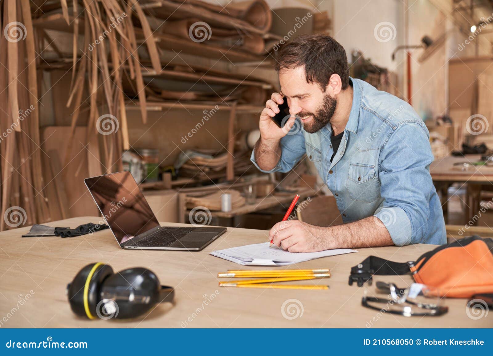 Craftsman Man Talking To Customer on the Phone Stock Photo - Image of ...