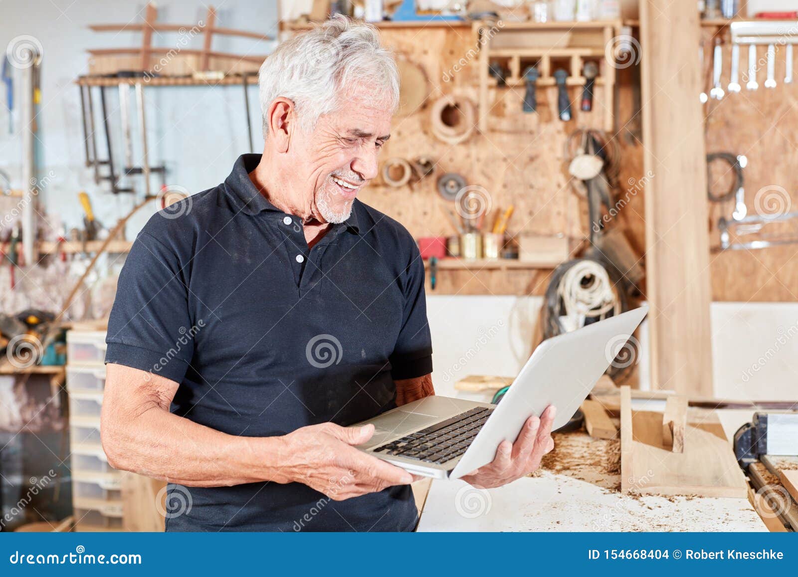 Craftsman Master with Laptop Computer Stock Photo - Image of senior ...