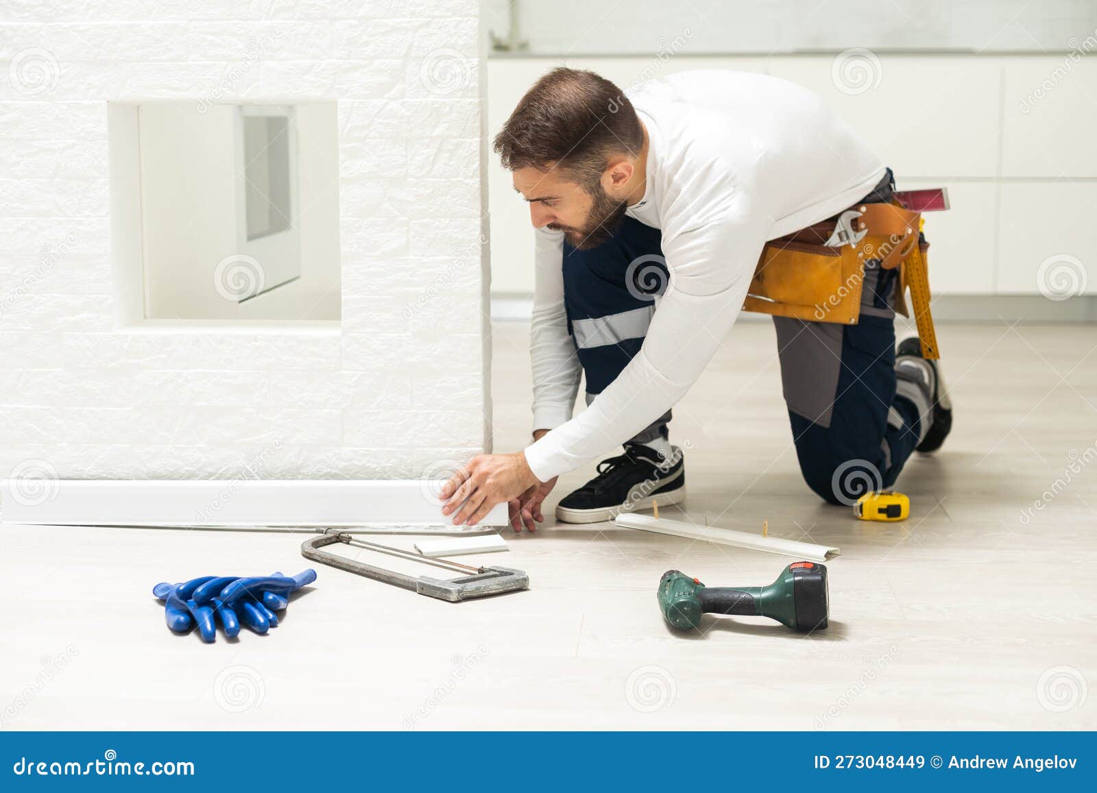 The Craftsman Measures the Length of the Plinth for Cutting, Installing ...