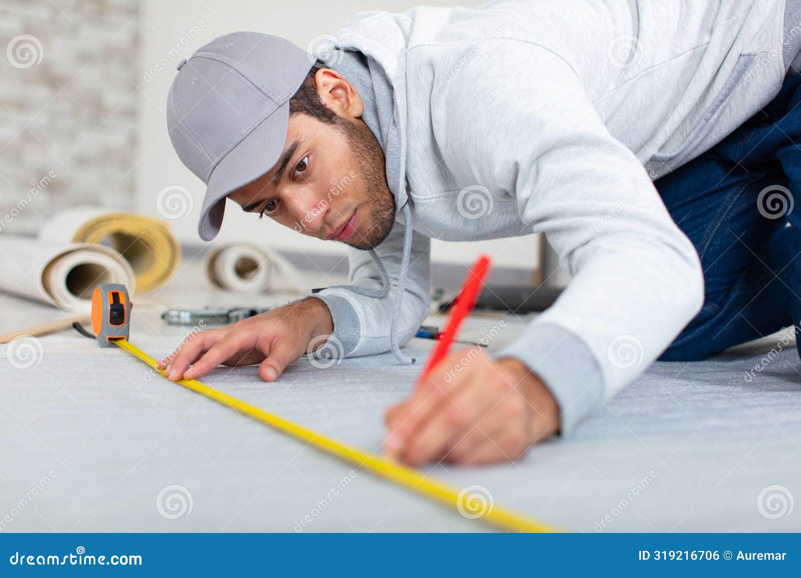 Craftsman Measuring Position on Floor with Ruler and Pencil Stock Photo ...