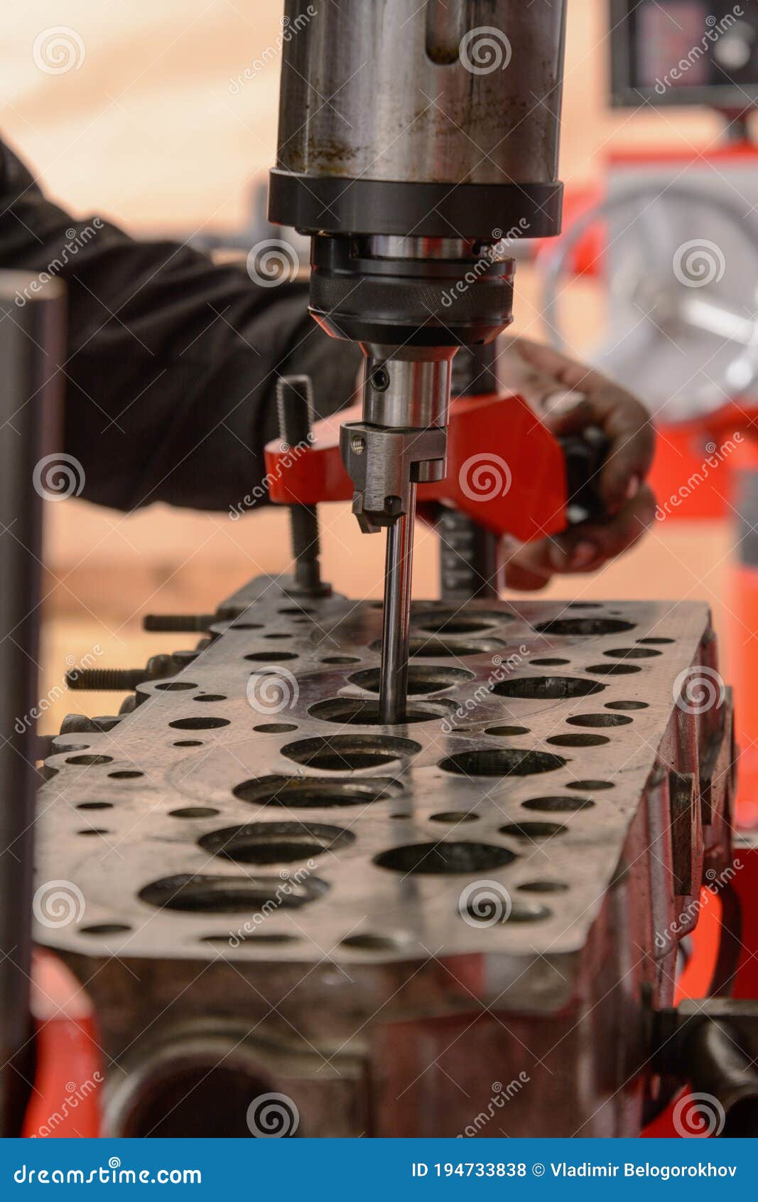 A Craftsman Sets Up a Machine for Grinding Car Valves Stock Photo ...