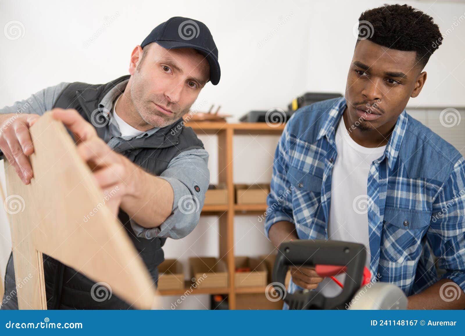 Craftsman Showing Wooden Template To Male Apprentice Stock Image ...