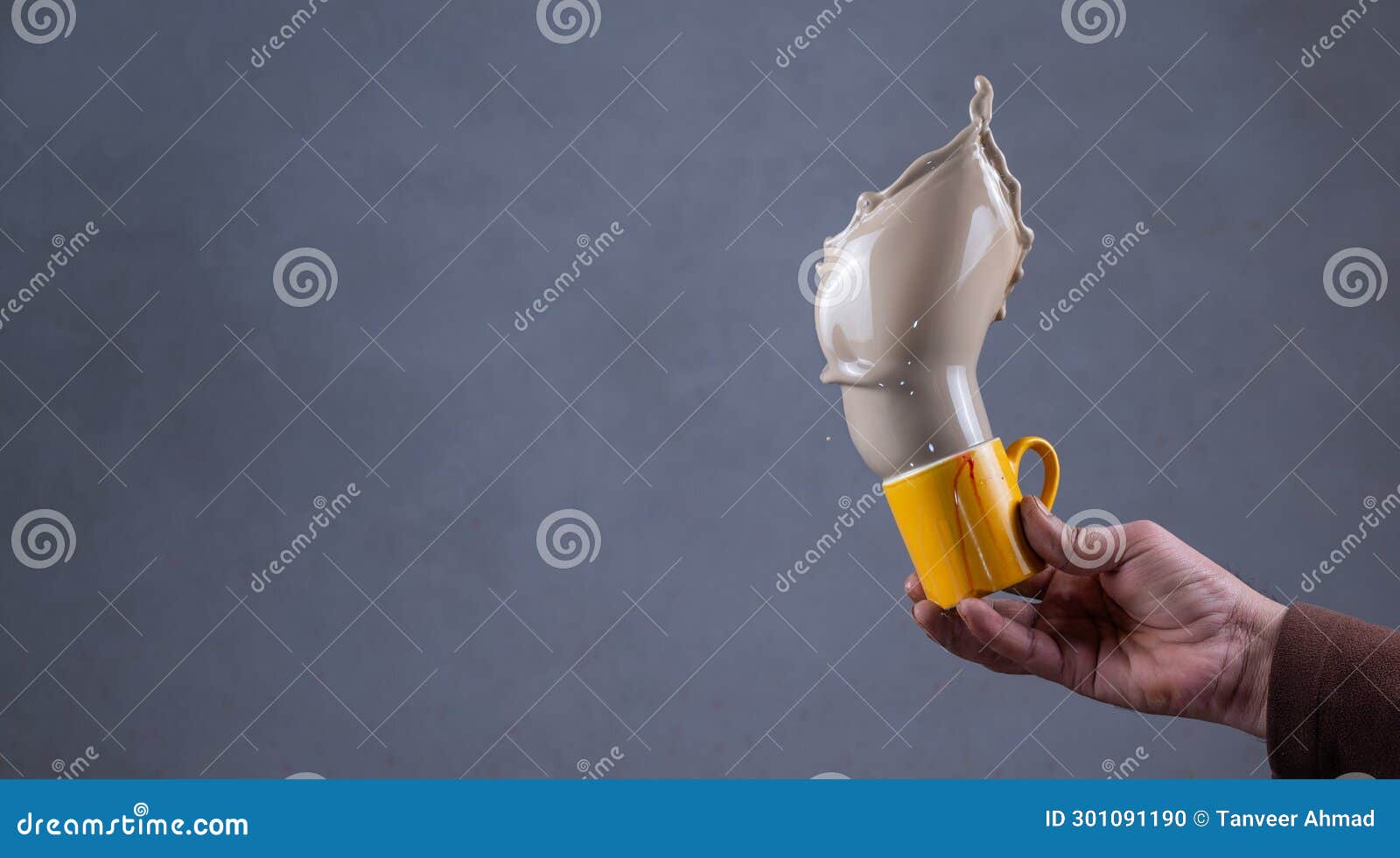 Craftsman Throwing Paint Splash on Wall from Yellow Cup - Creative ...