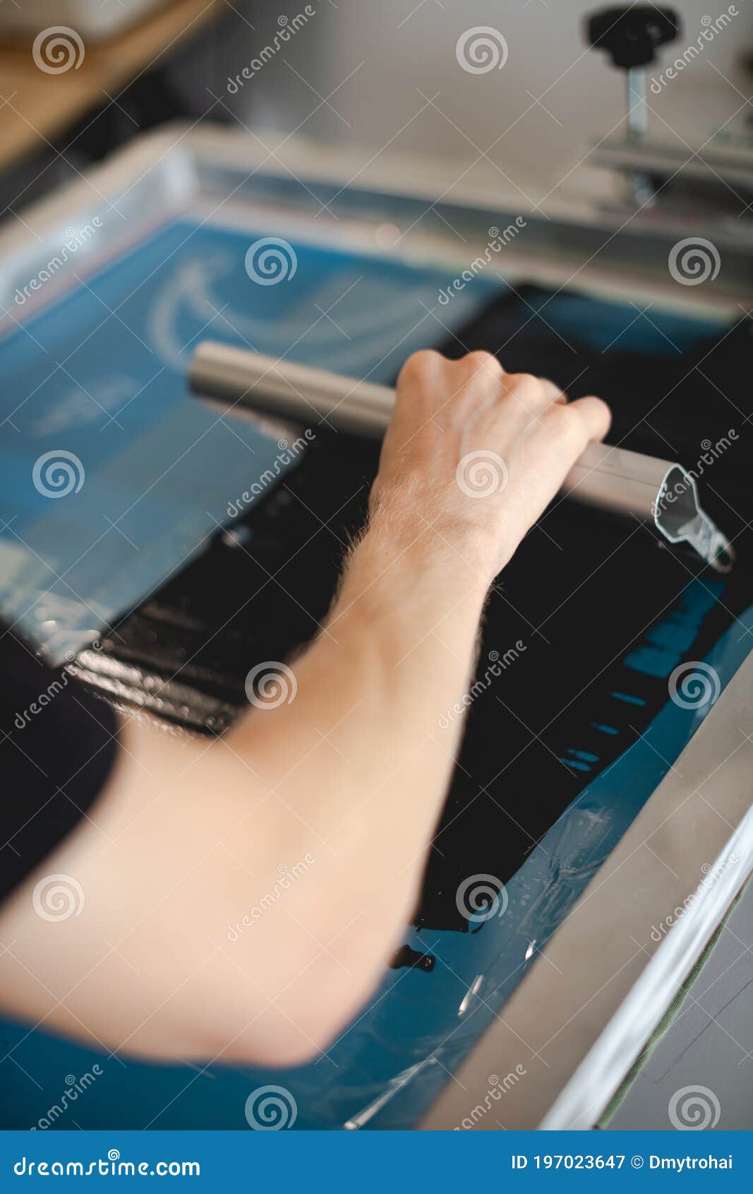 Craftsman Using Squeegee and Plastisol Ink while Working on Screen ...