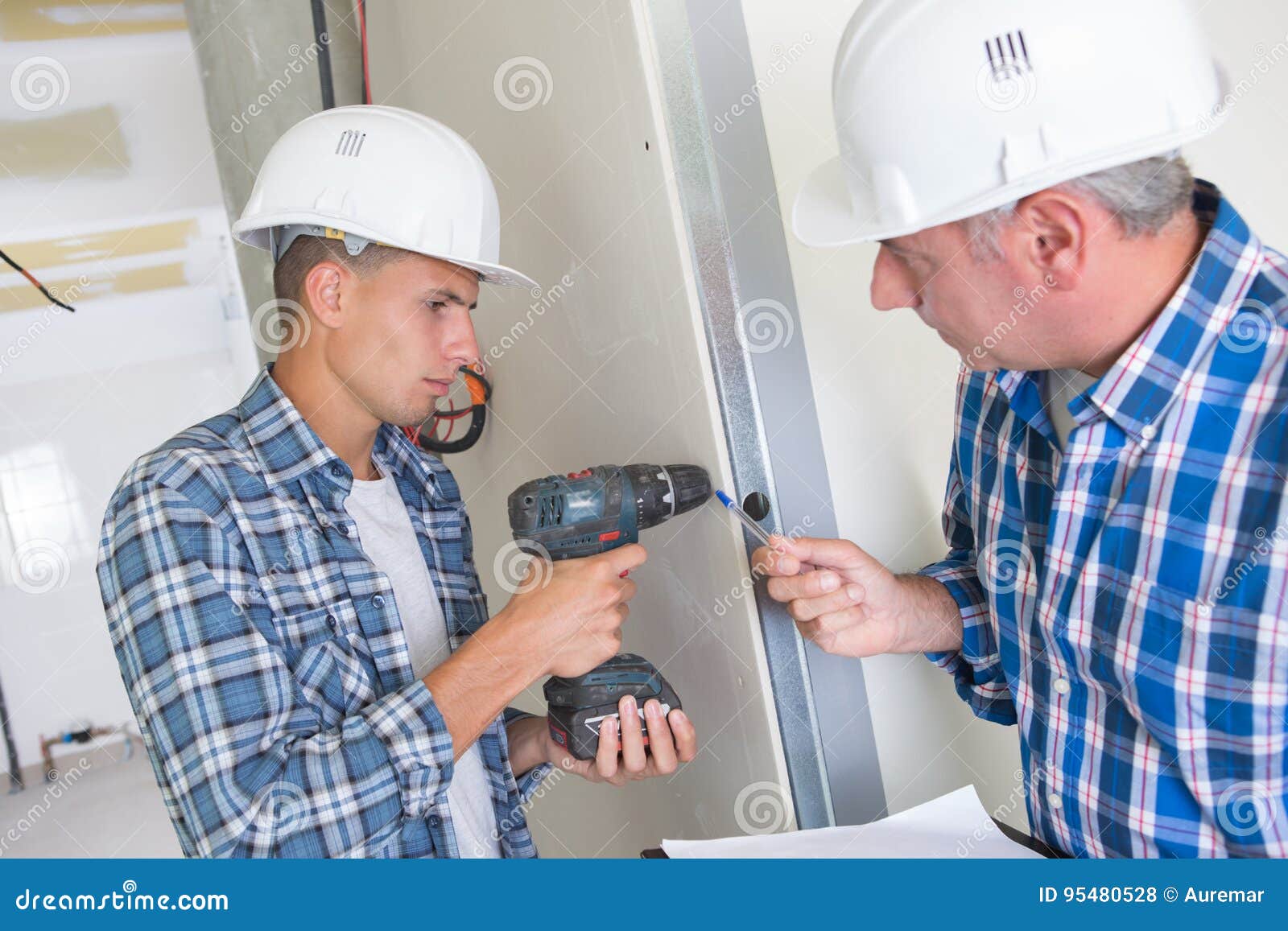 Craftsman Watching Over Male Apprentice Stock Photo - Image of male ...