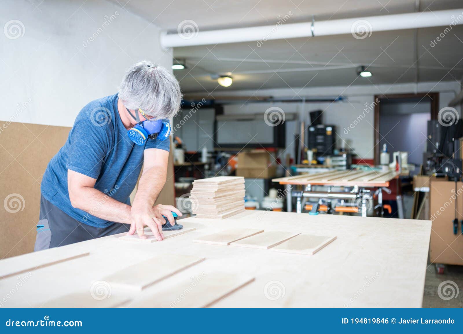 Craftsman Wearing Protection Mask Working in Their Workshop Stock Photo ...