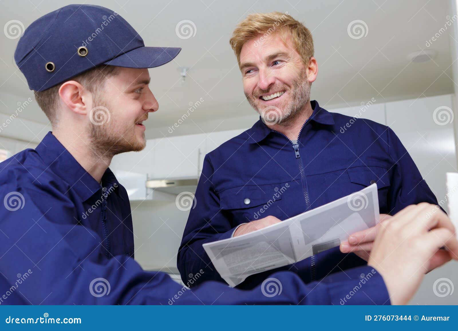 Craftsman and Young Apprentice Working Together Stock Photo - Image of ...