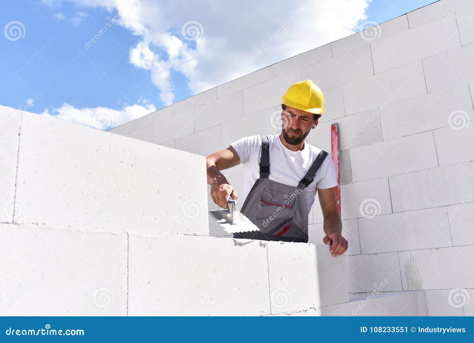 Craftsmen at Home Construction - Bricklayers Working in Work Clothes ...
