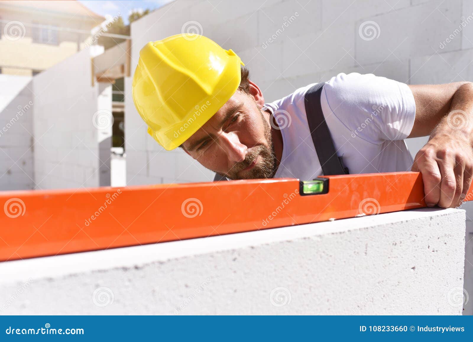 Craftsmen at Home Construction - Bricklayers Working in Work Clothes ...