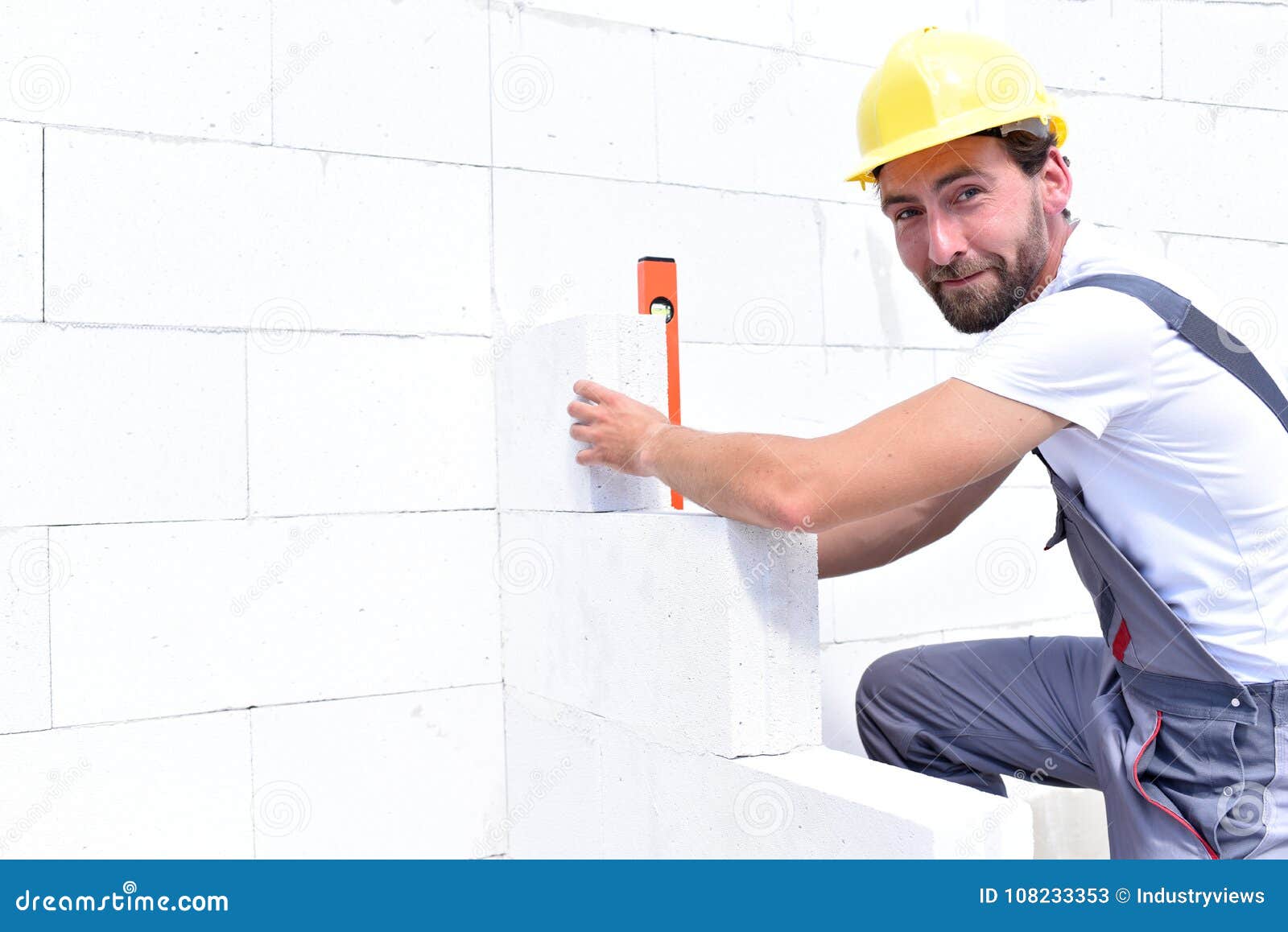 Craftsmen at Home Construction - Bricklayers Working in Work Clothes ...