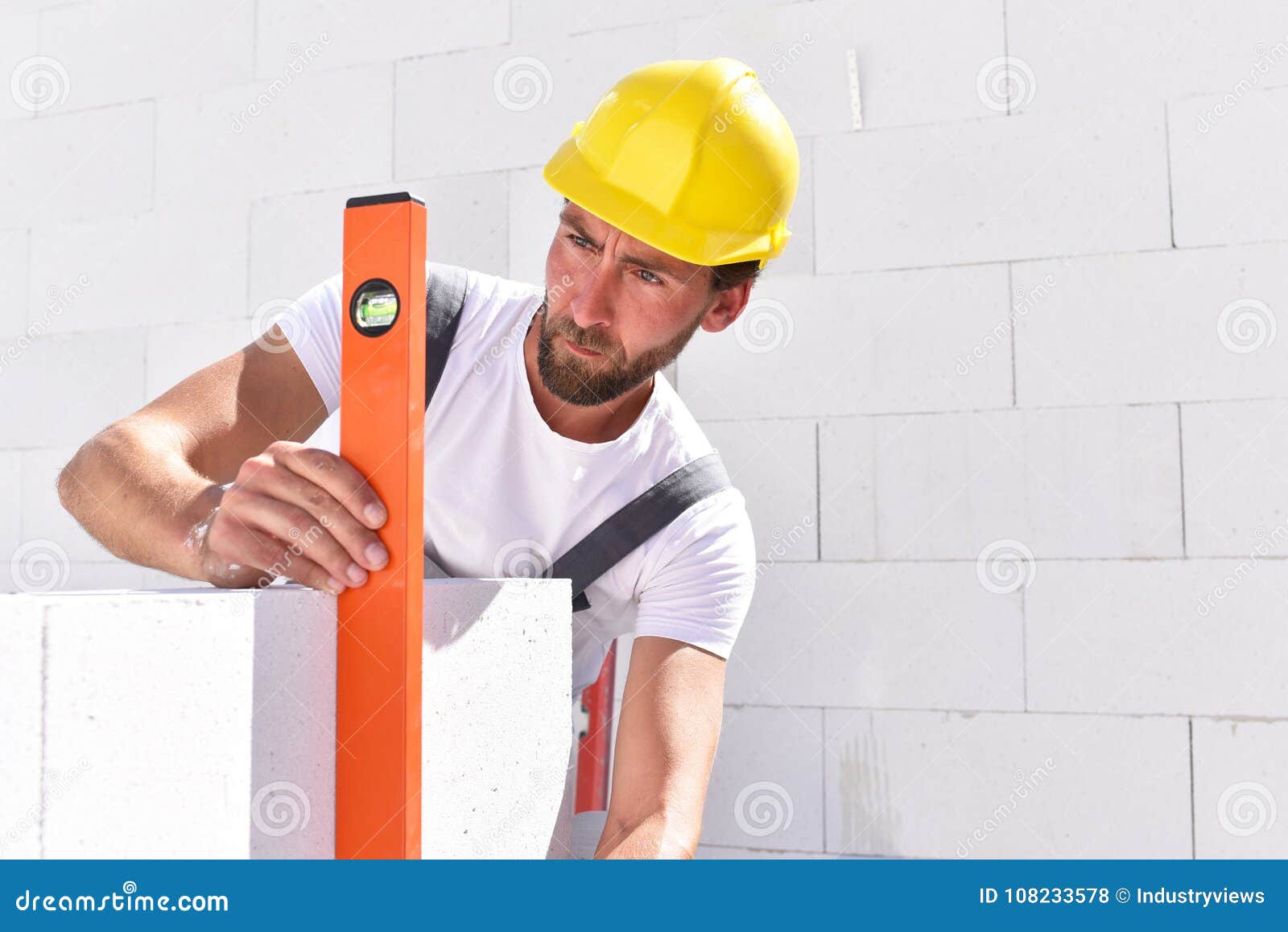 Craftsmen at Home Construction - Bricklayers Working in Work Clothes ...