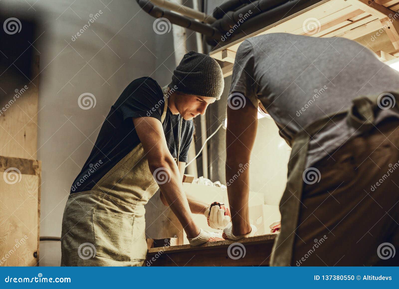 Craftsmen Making Measurements on Workbench Stock Photo - Image of ...