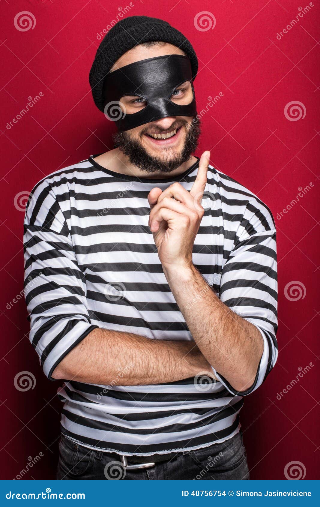 Crafty Bandit Smiling and Threaten with Finger Stock Photo - Image of ...