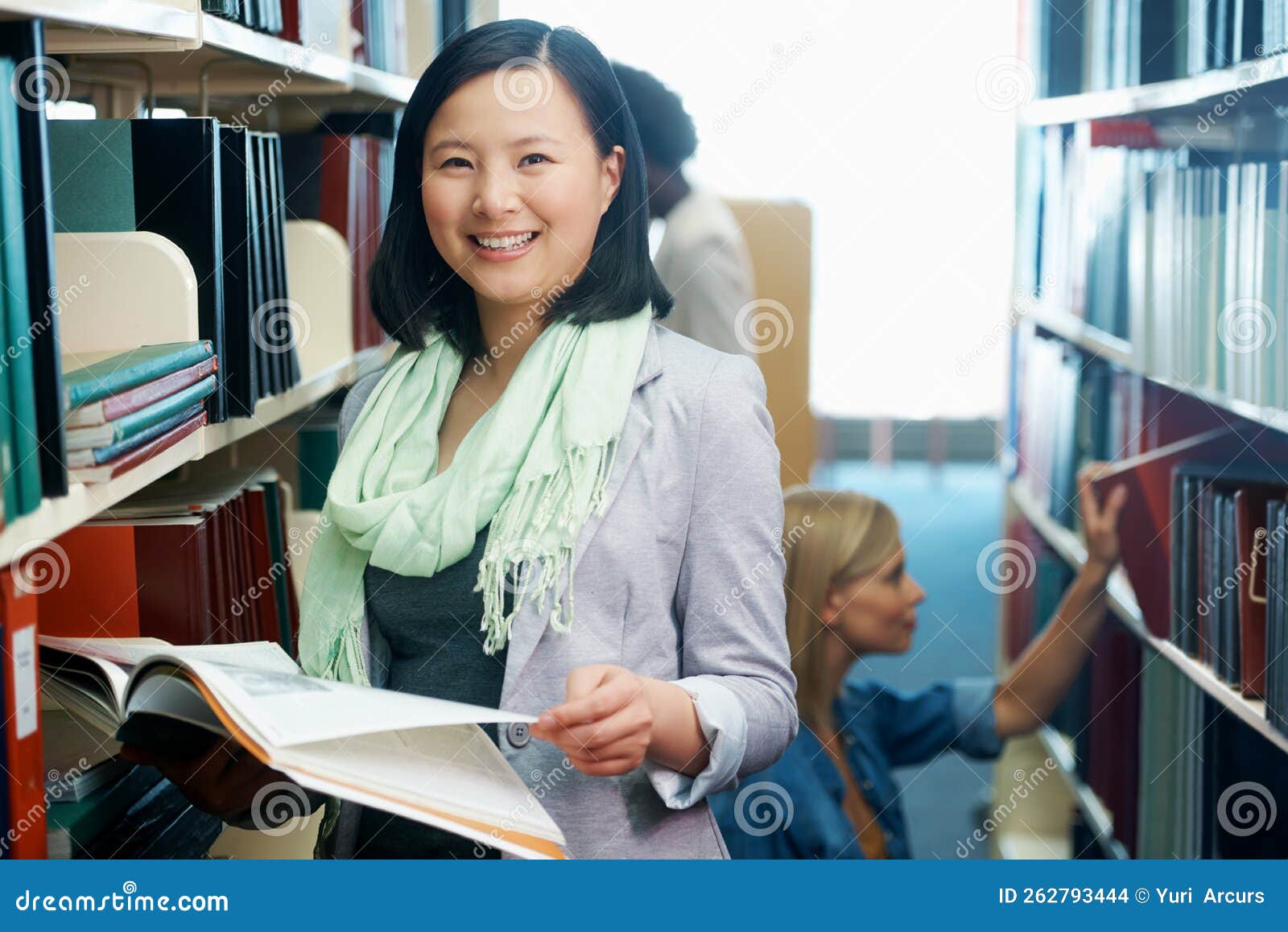 Cramming Some Last Minute Knowledge. a Young Woman Holding a Book in ...