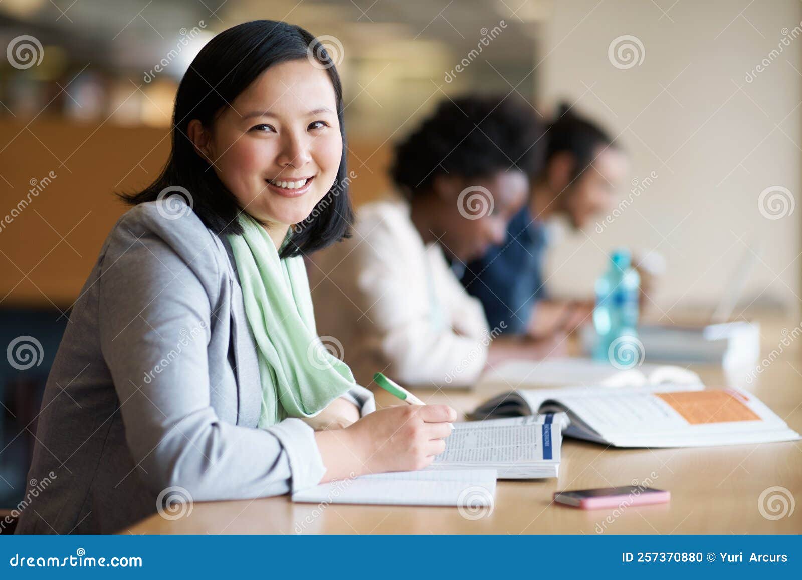 Cramming Some Last Minute Knowledge. a Young Woman Studying in the ...