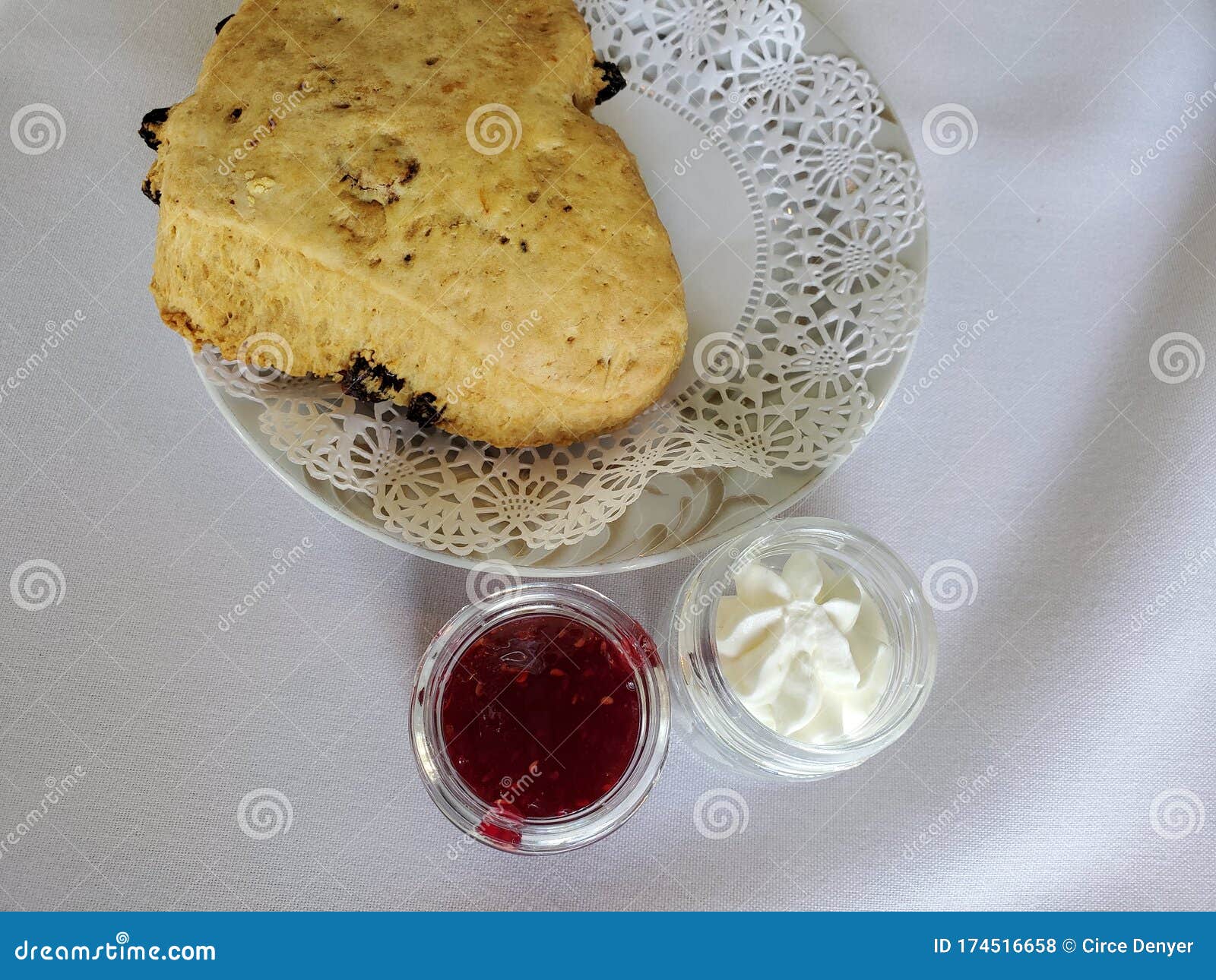 Cranberry Scone Raspberry Jam and Cream on a White Tablecloth Stock ...