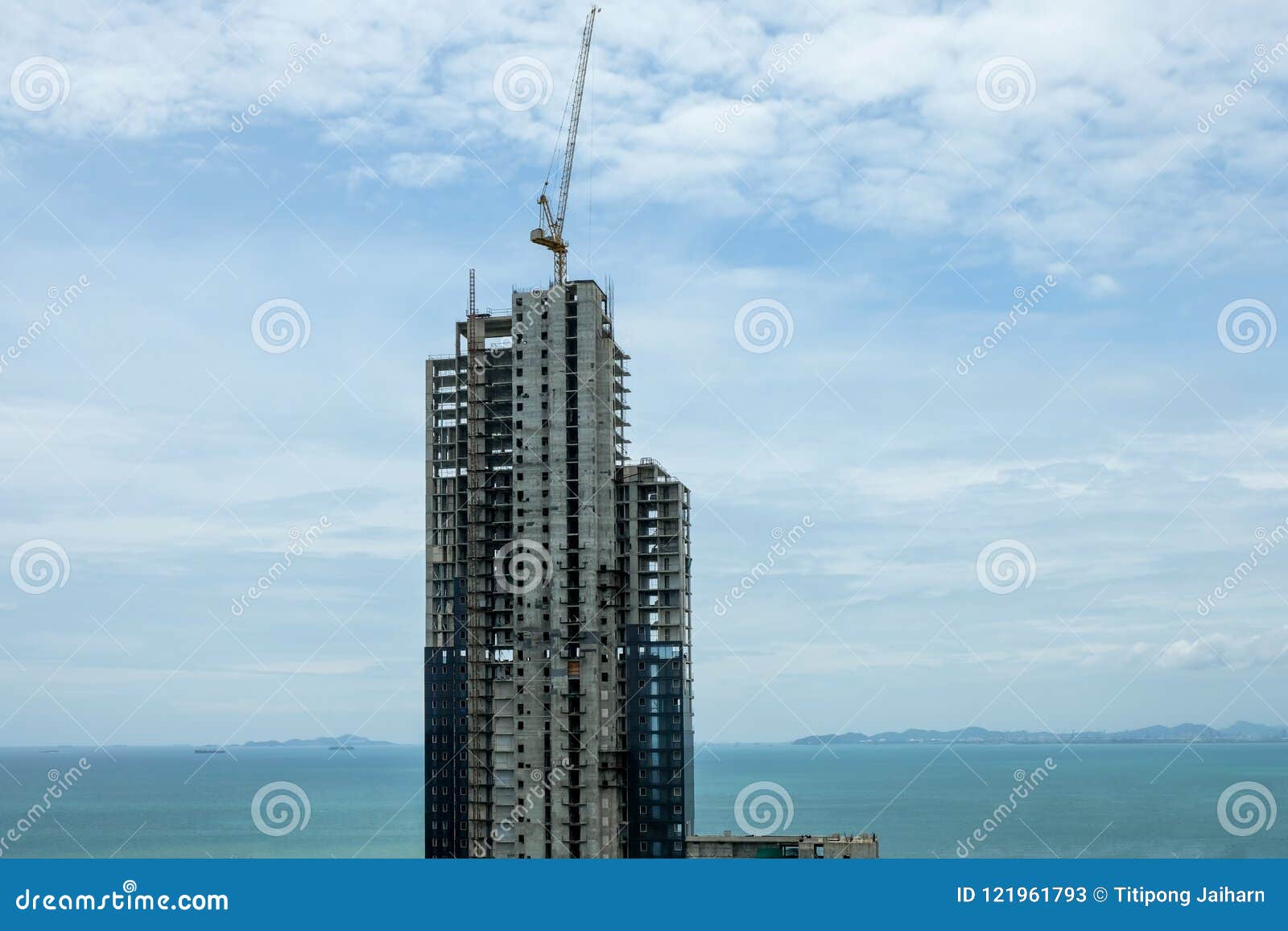 Crane Build a Building on the Beach in Front of Sea Stock Image - Image ...