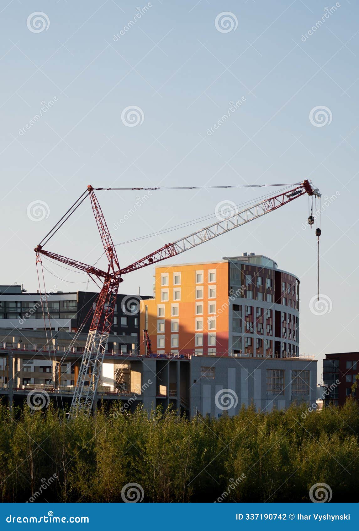 Crane and Building Construction. Construction Crane on Housing Stock ...