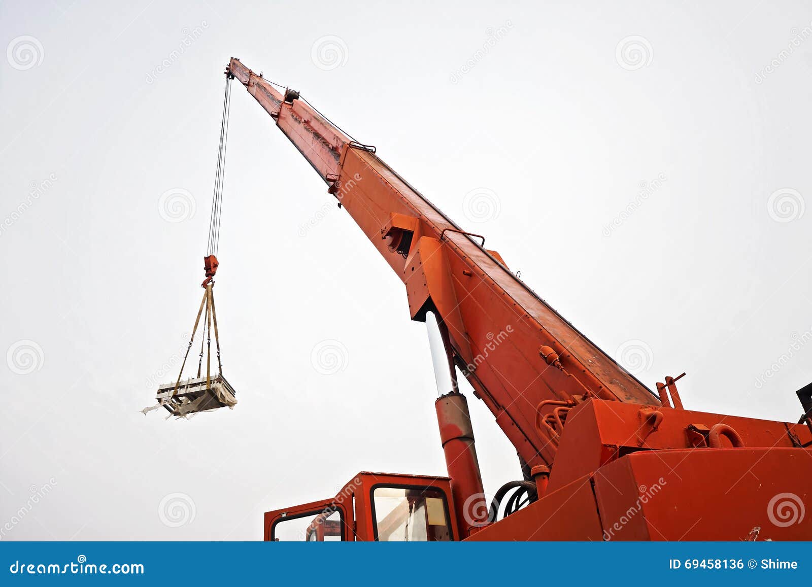 Crane carrying a cargo stock photo. Image of vehicle - 69458136