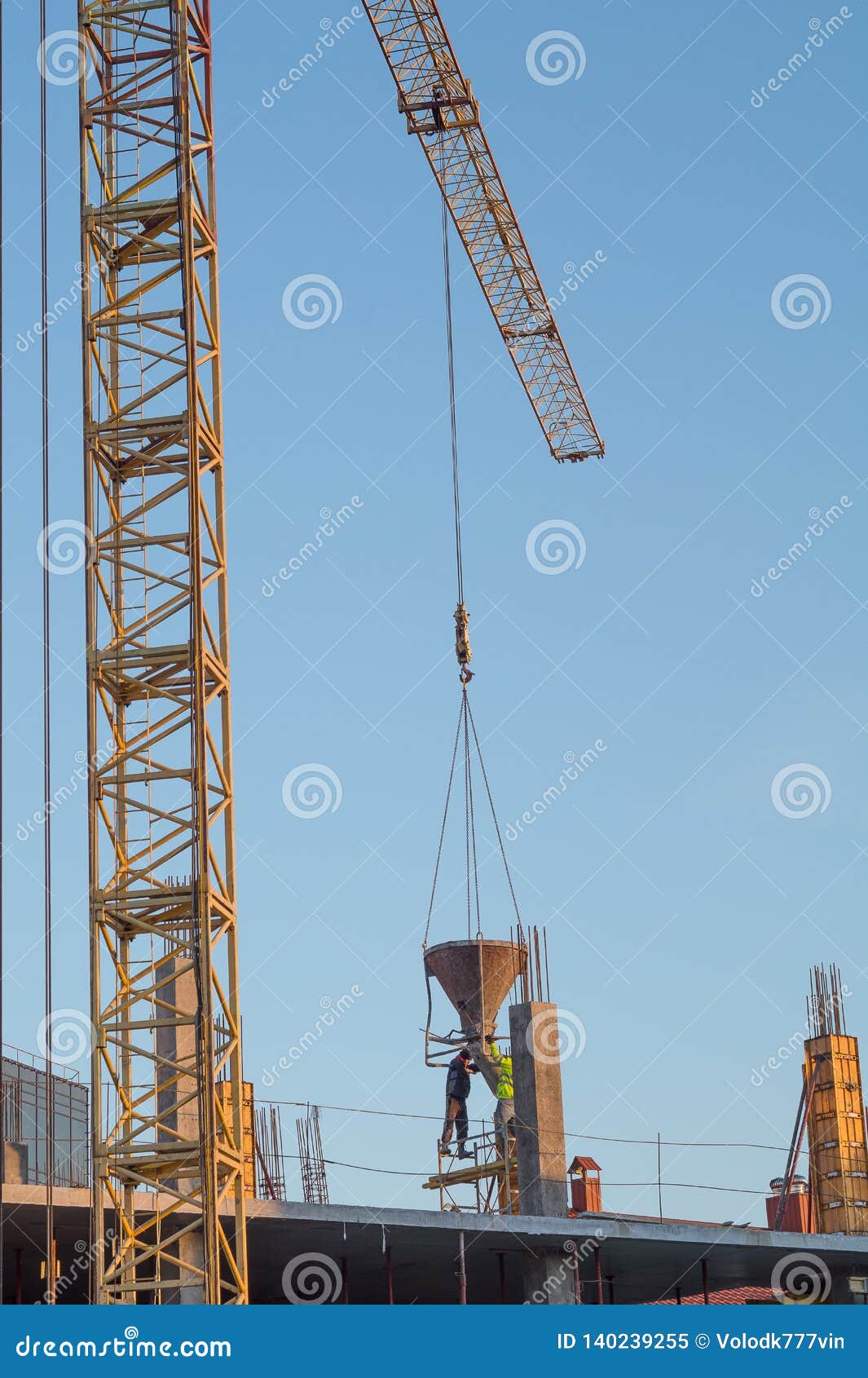 Crane Work. Crane on the Construction Lowered the Concrete To Workers ...