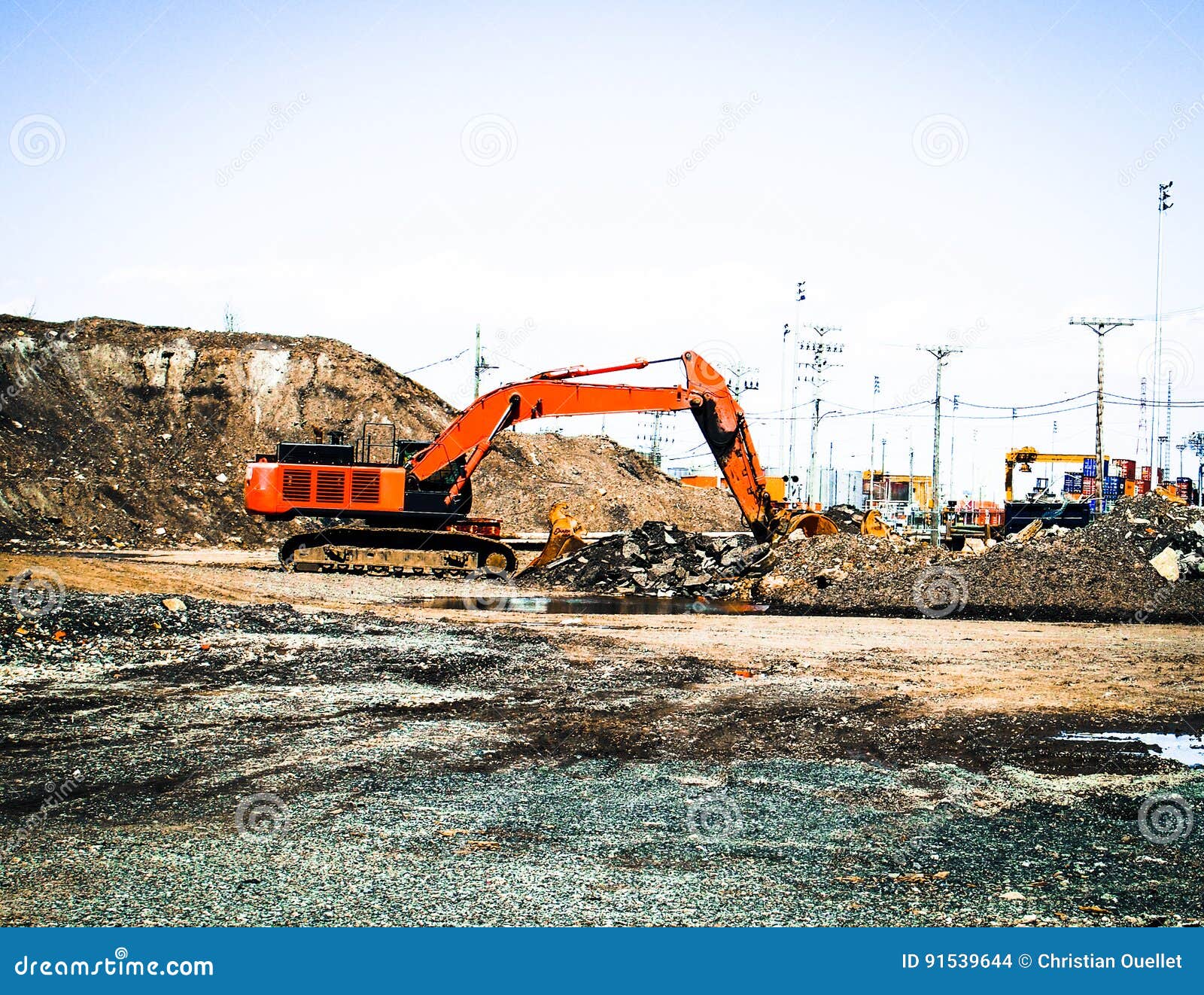 Crane dig into the ground stock photo. Image of tractor - 91539644
