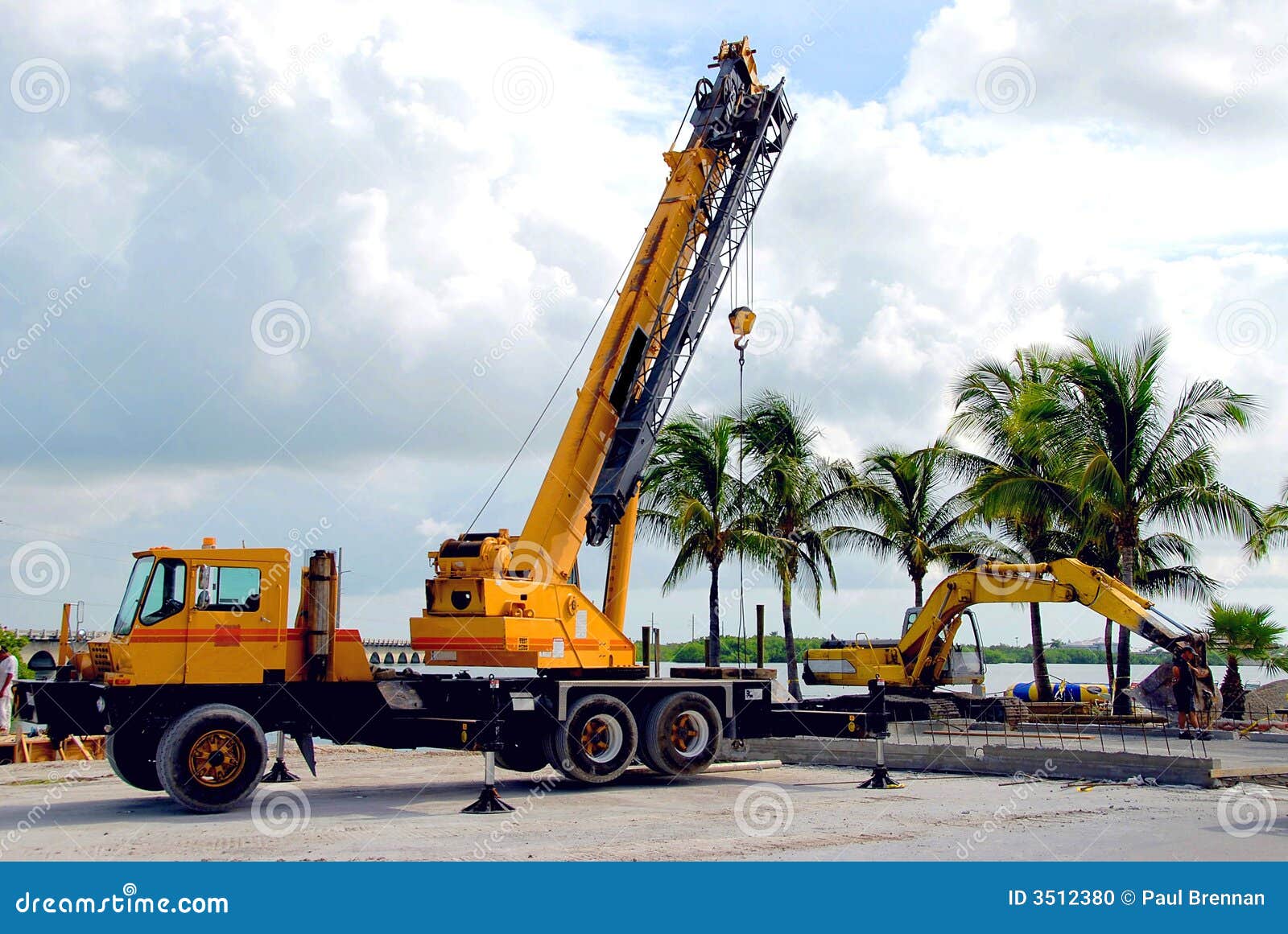 Crane at construction site stock photo. Image of palm - 3512380
