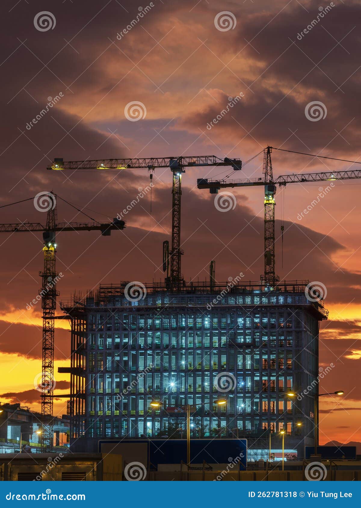 Crane in Construction Site for High Rise Building Under Sunset Stock ...