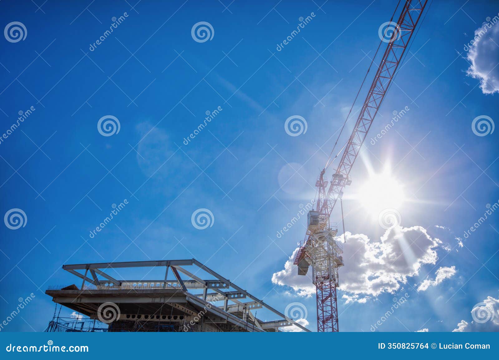 Crane on a Construction Site, Modern Building, Sun Backlit, Wide ...