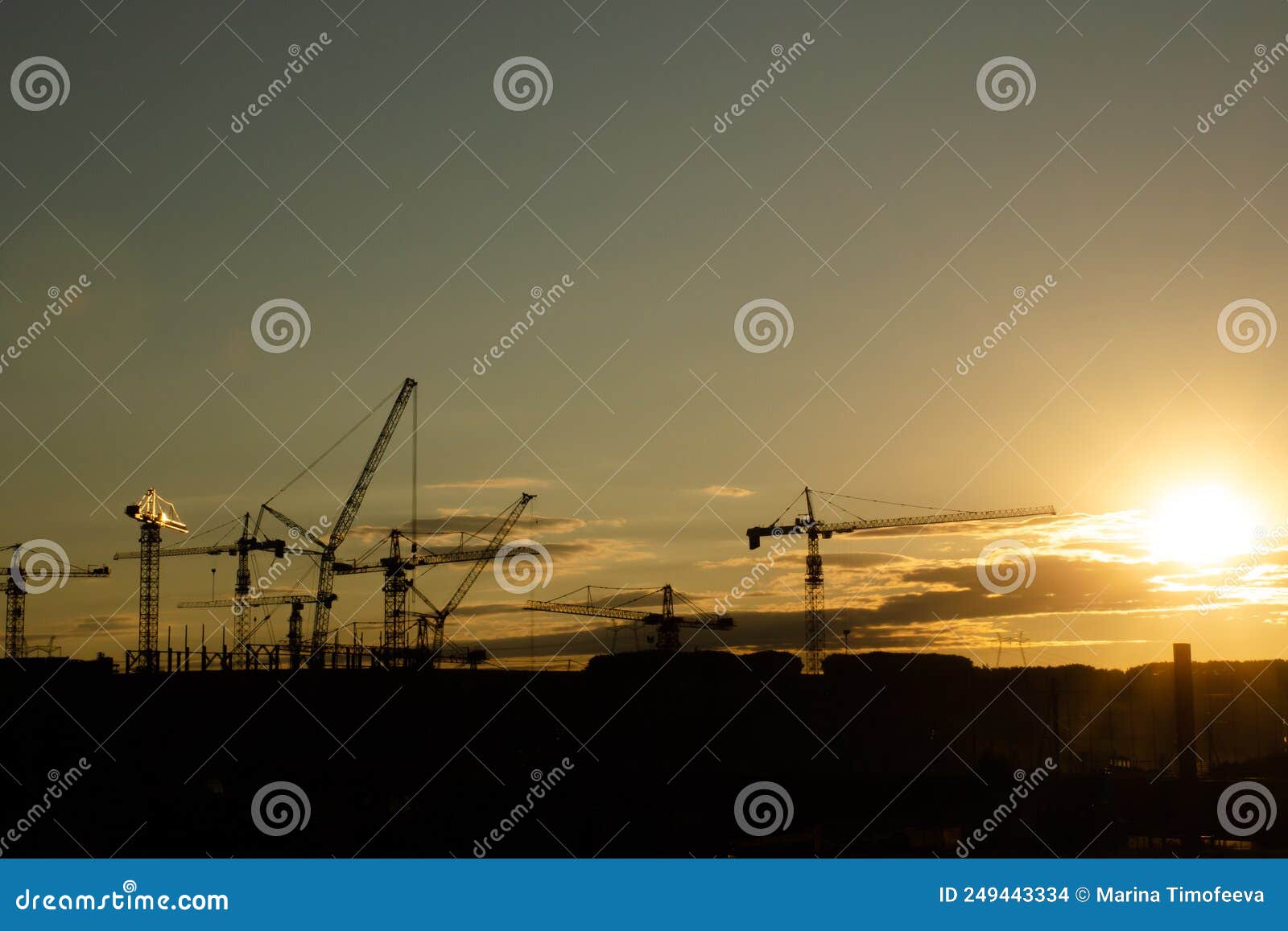 Crane and Construction Site Sunset. Building Development and ...