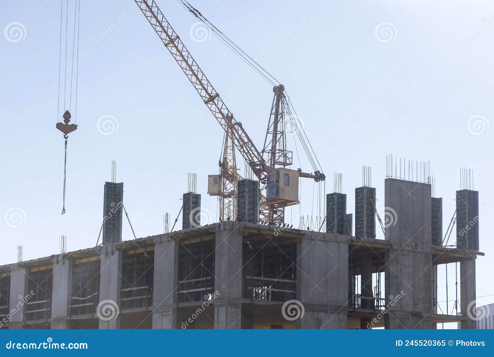 A Crane in Construction Work a Concrete of High-rise Building Under ...