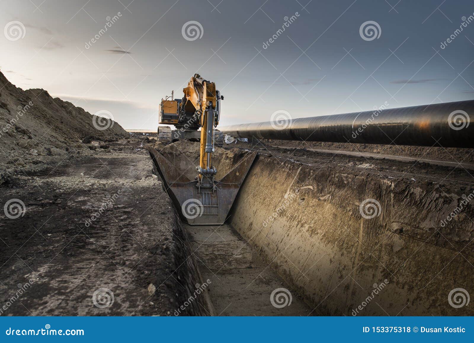 Crane Digging a Channel for Gas Pipeline Stock Photo - Image of evening ...