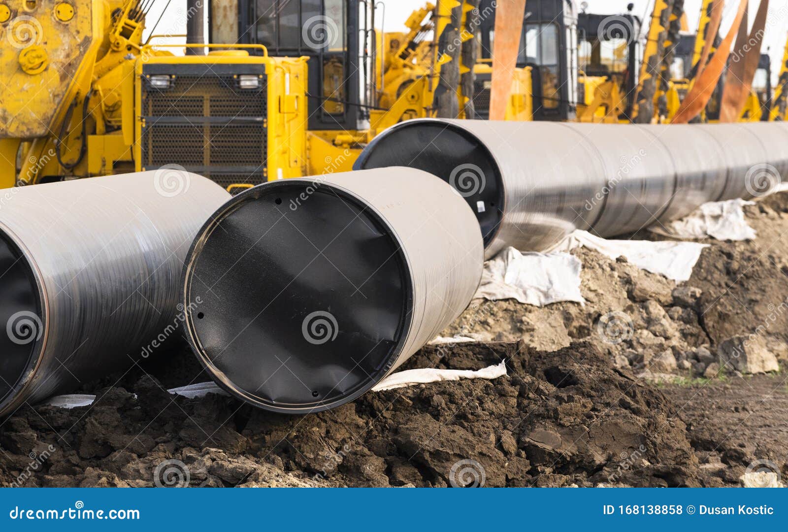 Crane Digging a Channel for Gas Pipeline Stock Photo - Image of ...