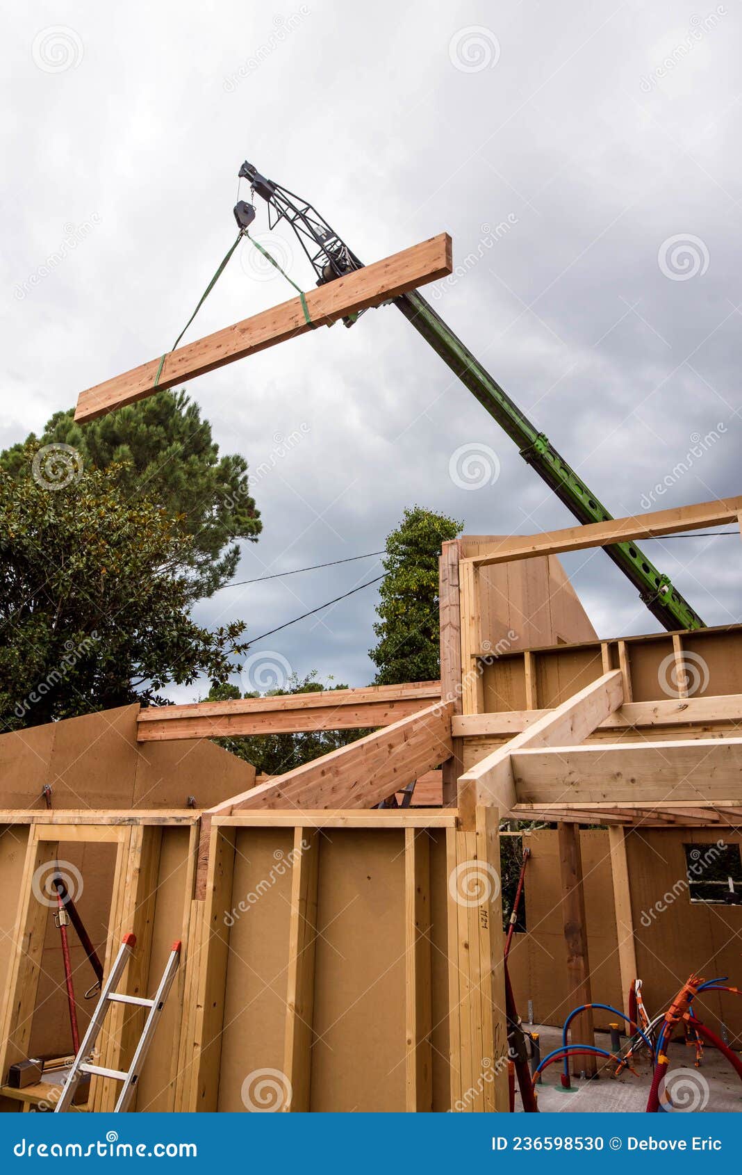 Crane Handling the Frame of an Ecological Wooden House Stock Photo ...